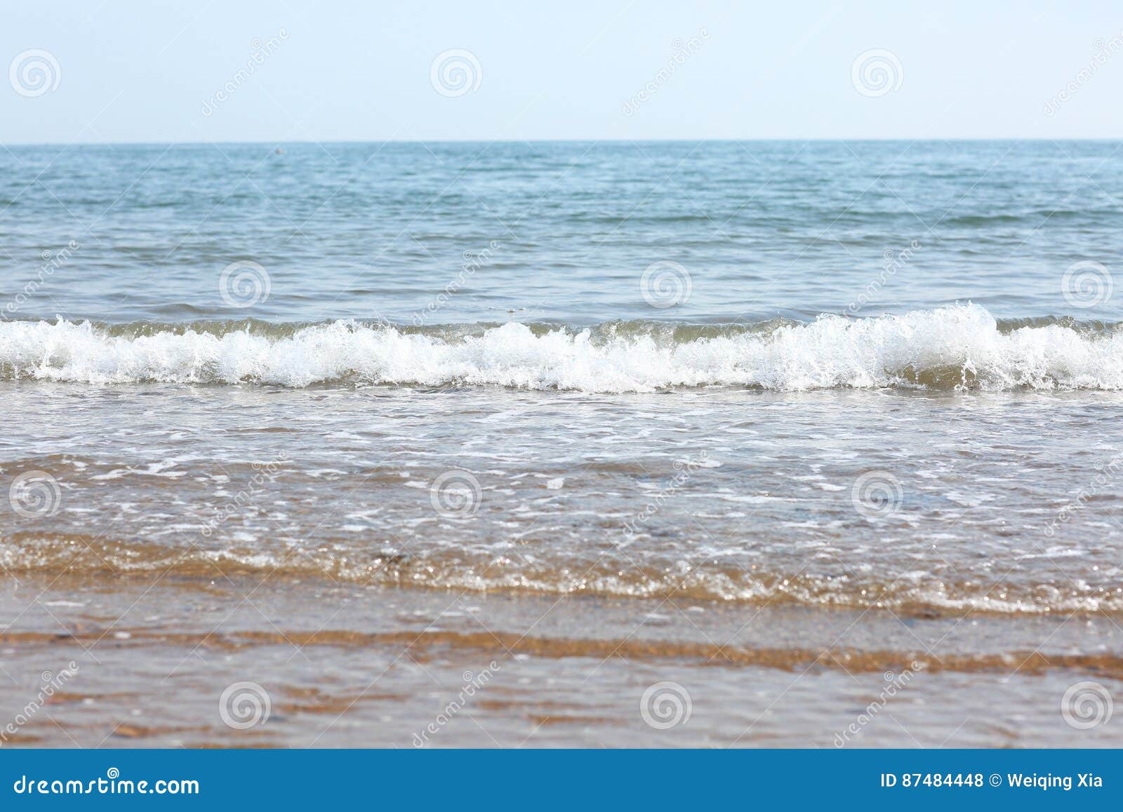 Waves on the beach stock photo. Image of movement, distance - 87484448