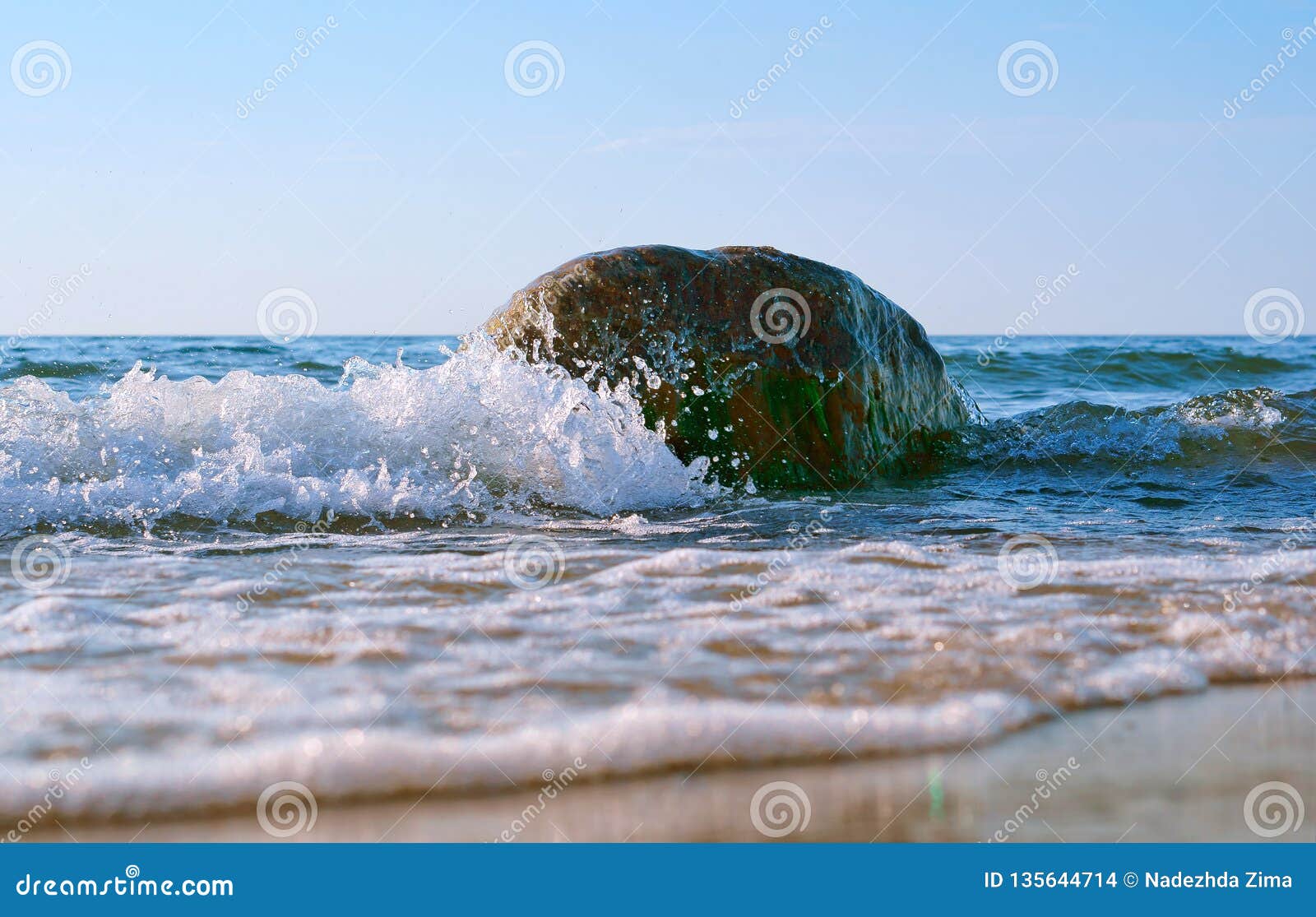 The Waves Beating Against the Rocks Stock Photo - Image of foam, ripple ...