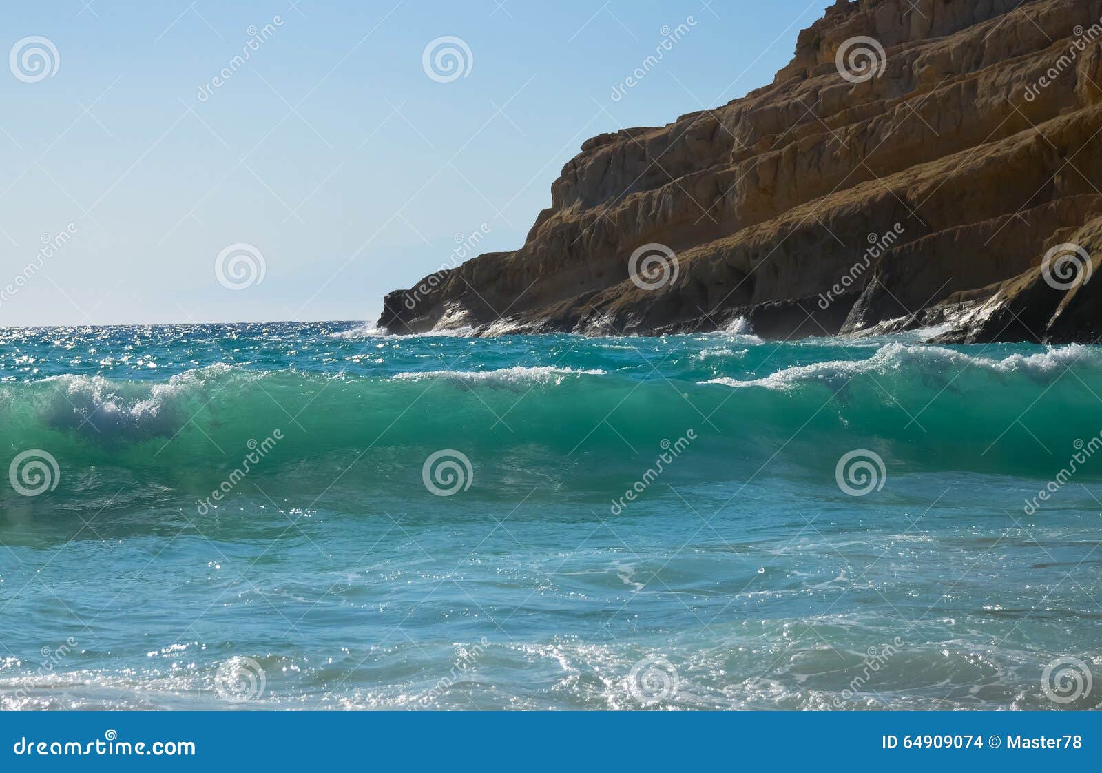 Waves beating on the shore stock photo. Image of beating - 64909074