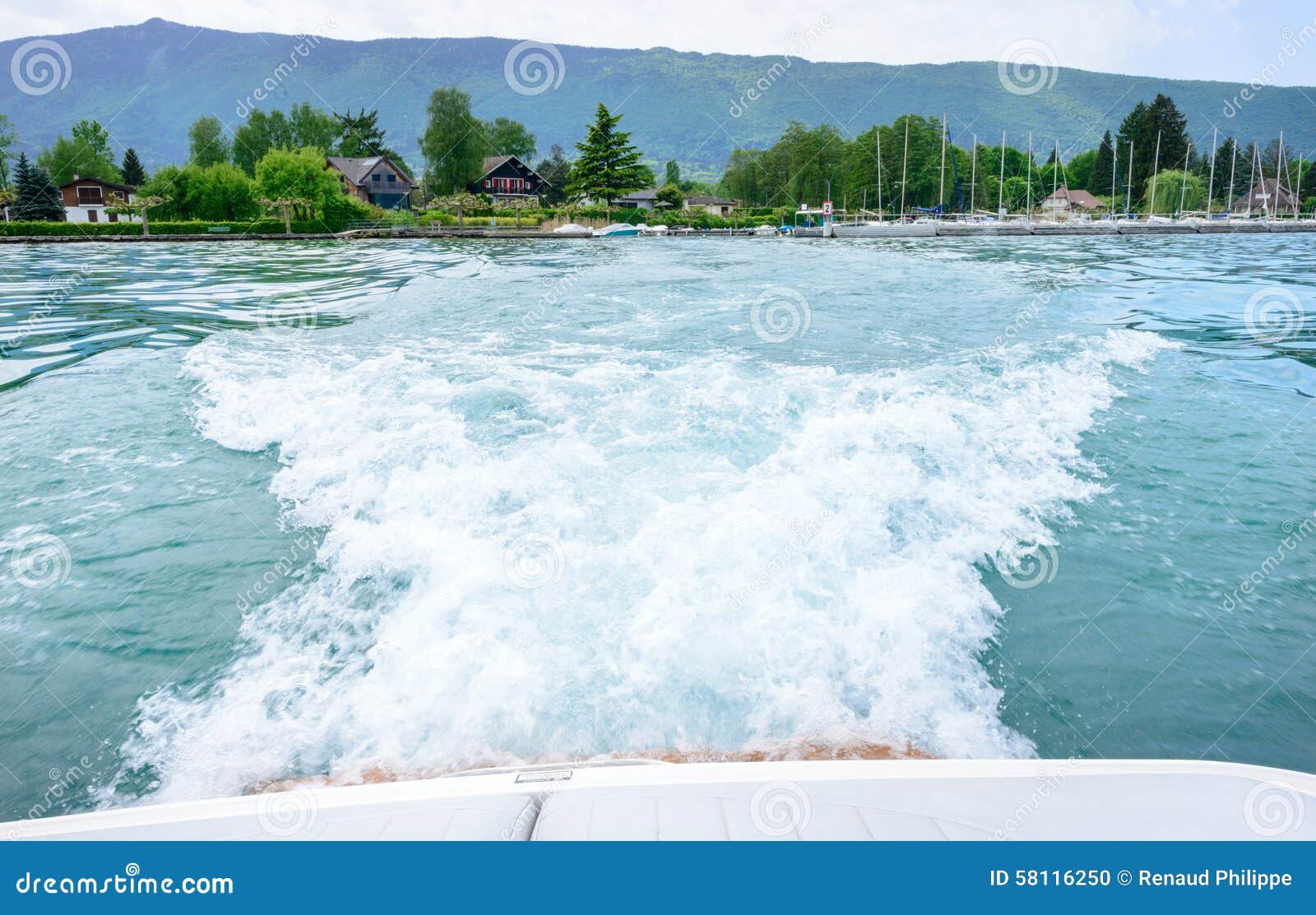 Waves behind a motorboat stock photo. Image of ocean - 58116250