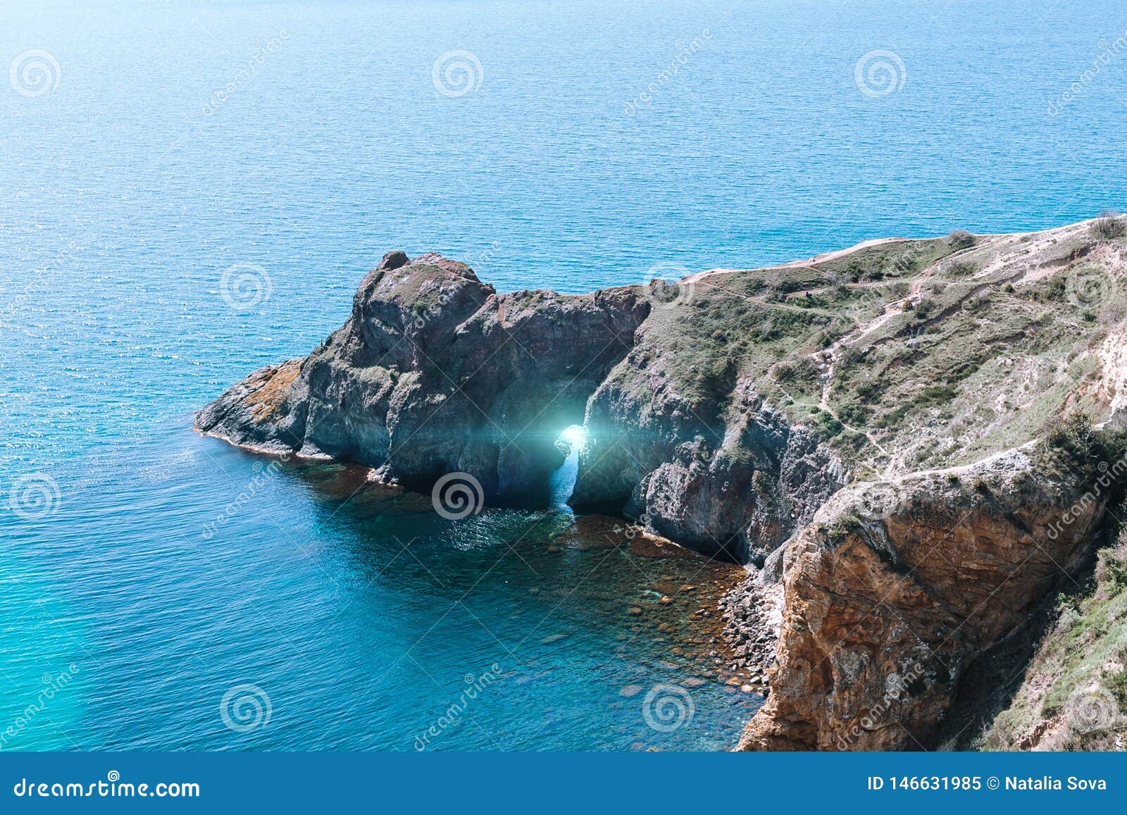 Waves of Blue Sea Splashing on the Sand-colored Cliffs. Stock Image ...