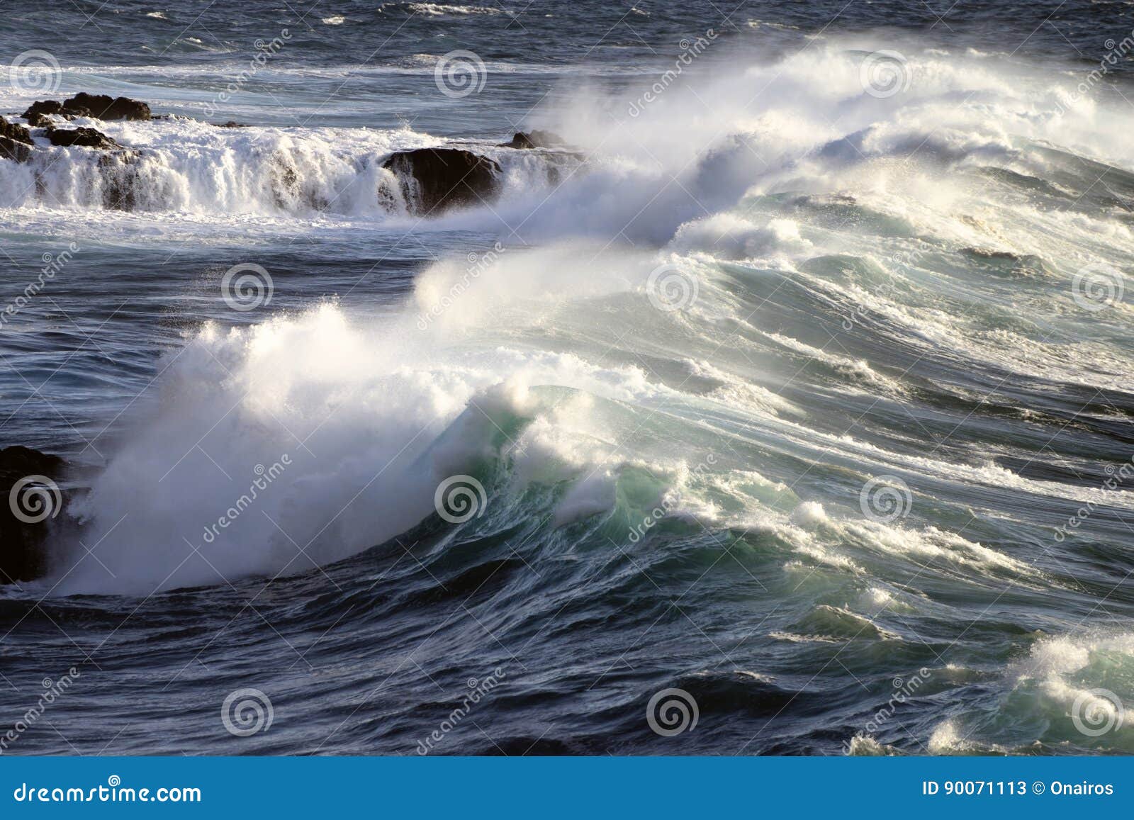 Waves braking on the rocks stock image. Image of storm - 90071113