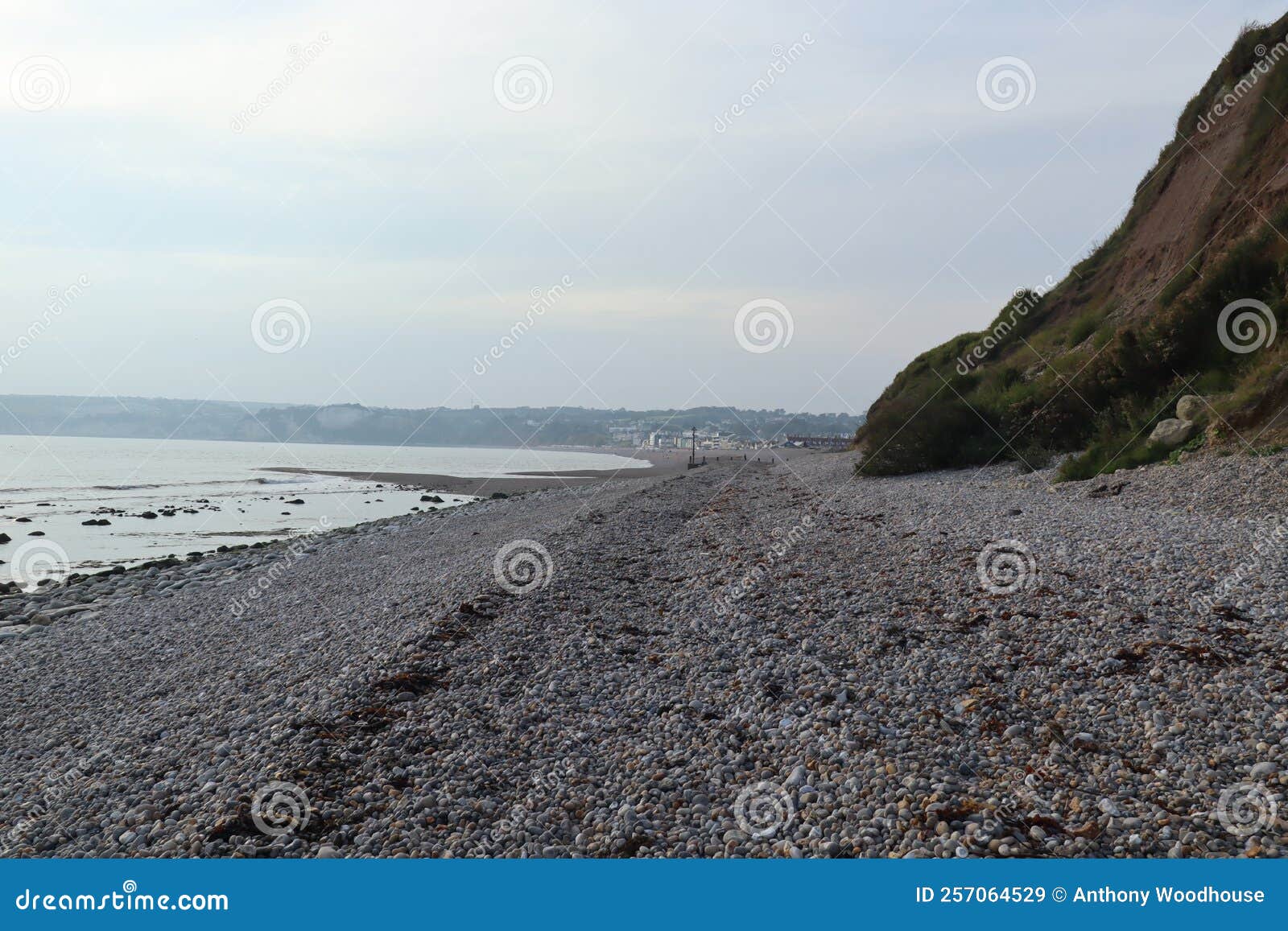Waves Break Gently on To the Pebble Beach at Axmouth in Devon Stock ...