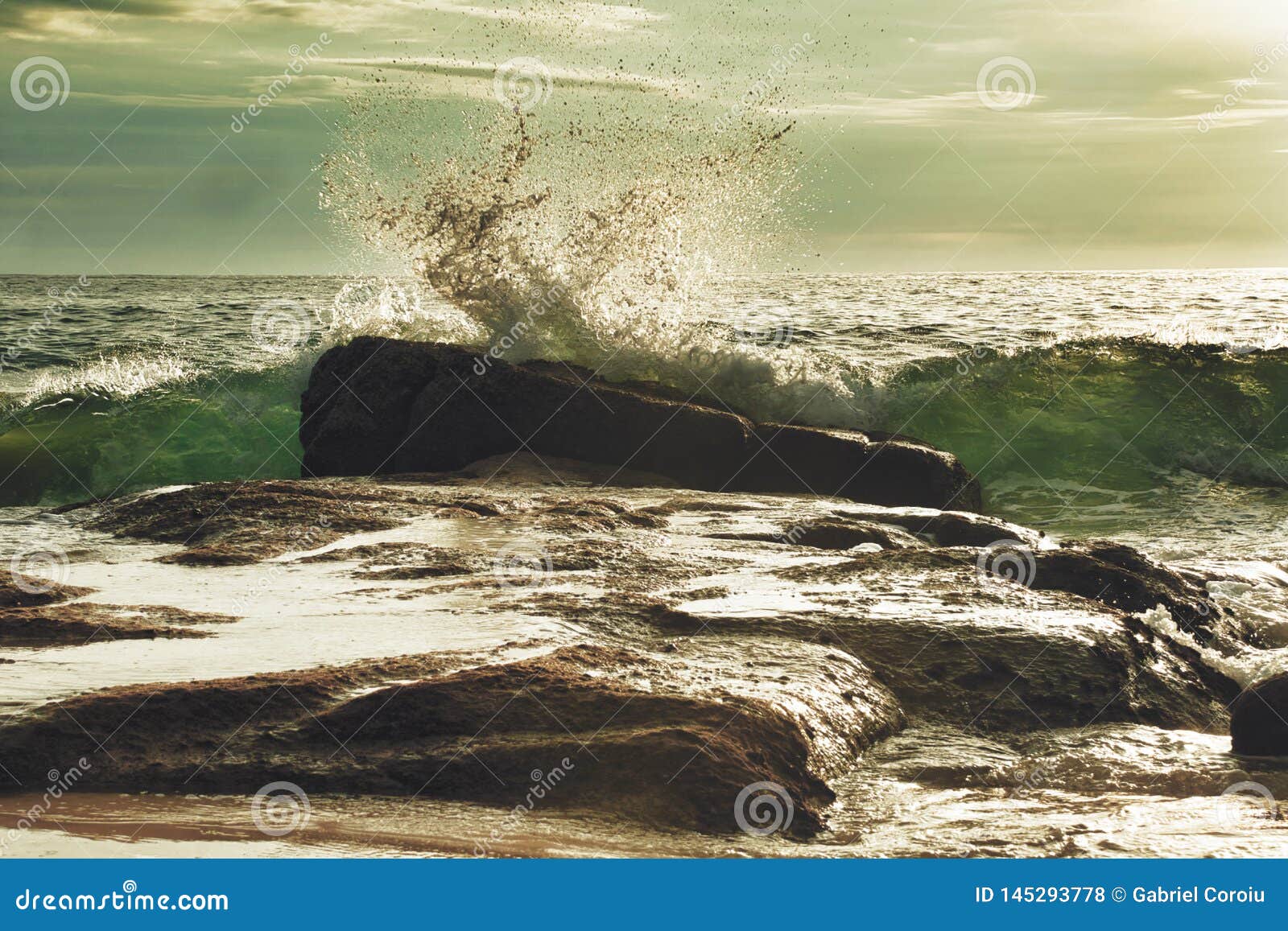 Waves break by a stone stock photo. Image of stone, contour - 145293778