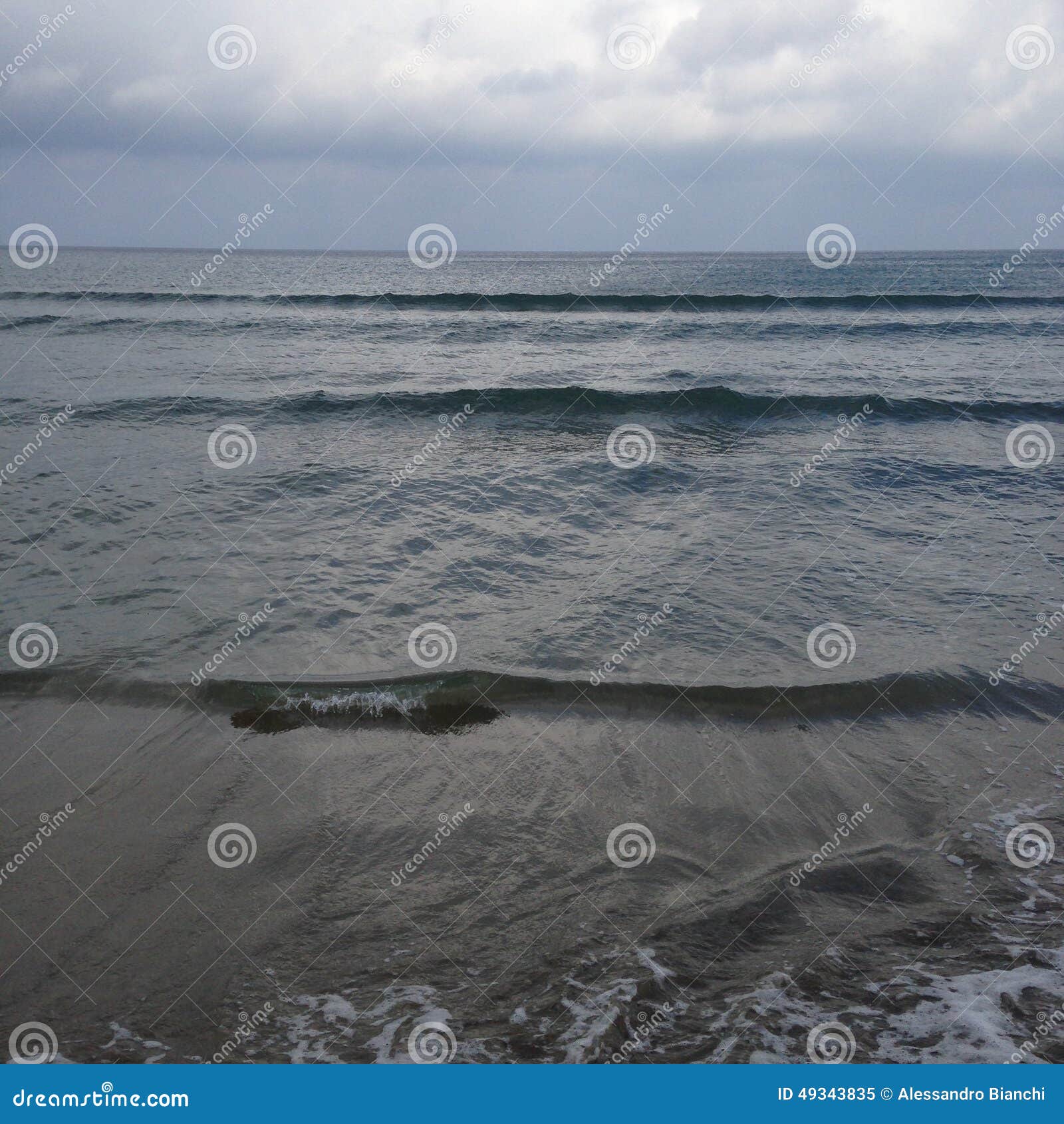 Waves breaking on a beach stock image. Image of receding - 49343835