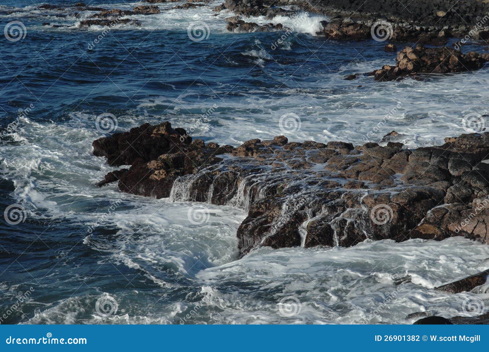 Waves breaking on rocks stock photo. Image of coastal - 26901382