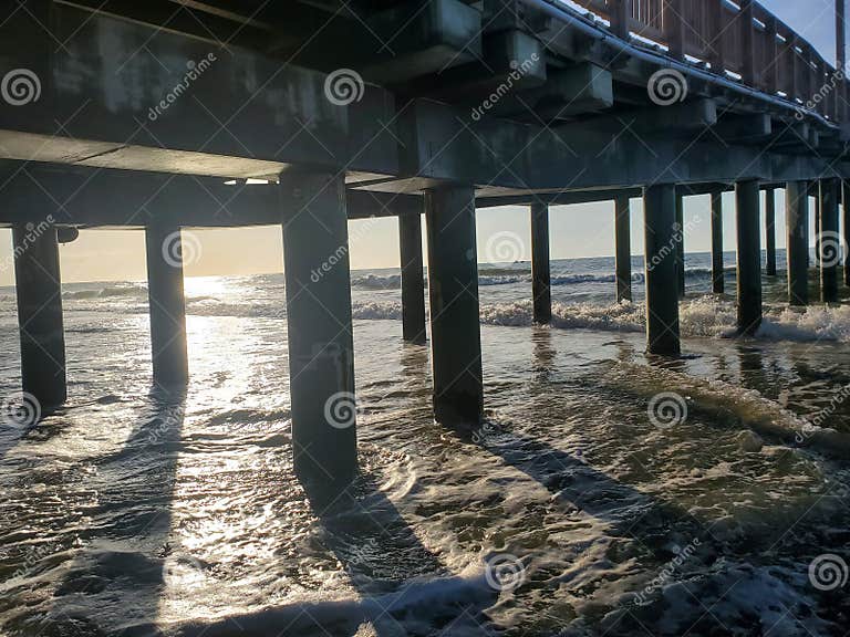 Waves crash at the pier stock photo. Image of pier, boardwalk - 253780220