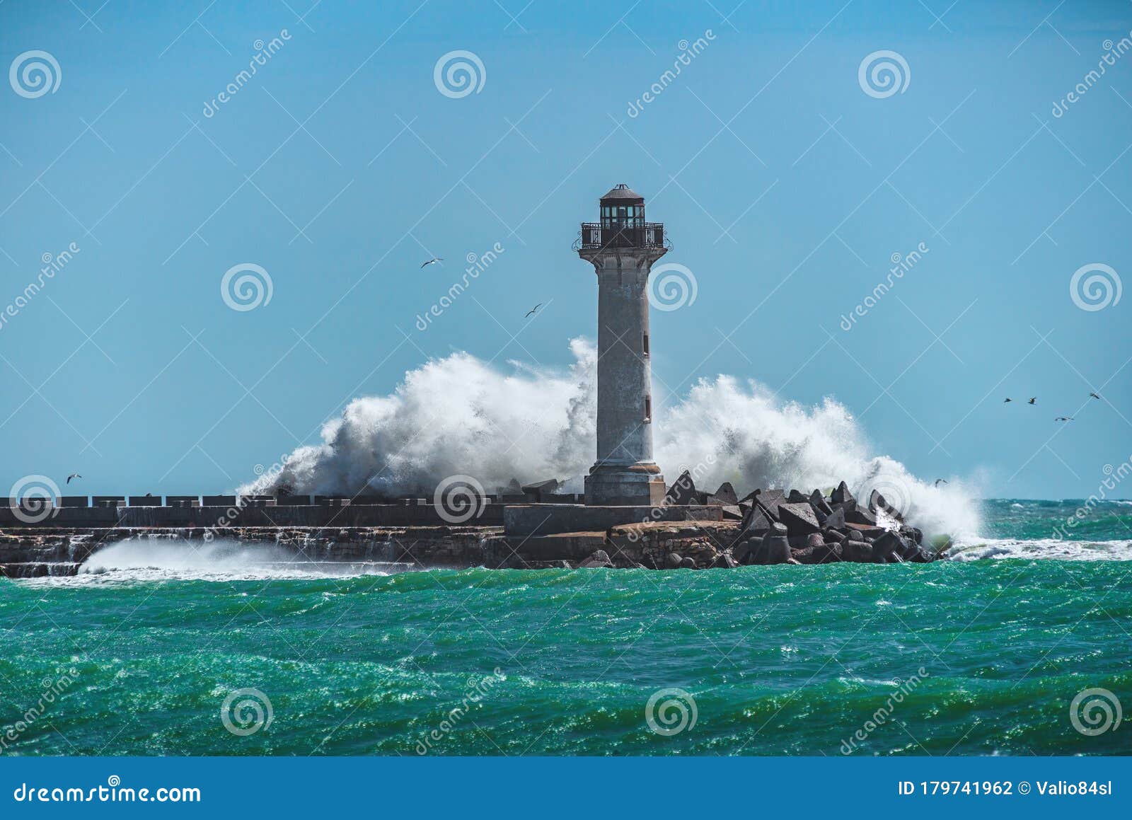 Sea Waves Crashing on Lighthouse Stock Photo - Image of light ...