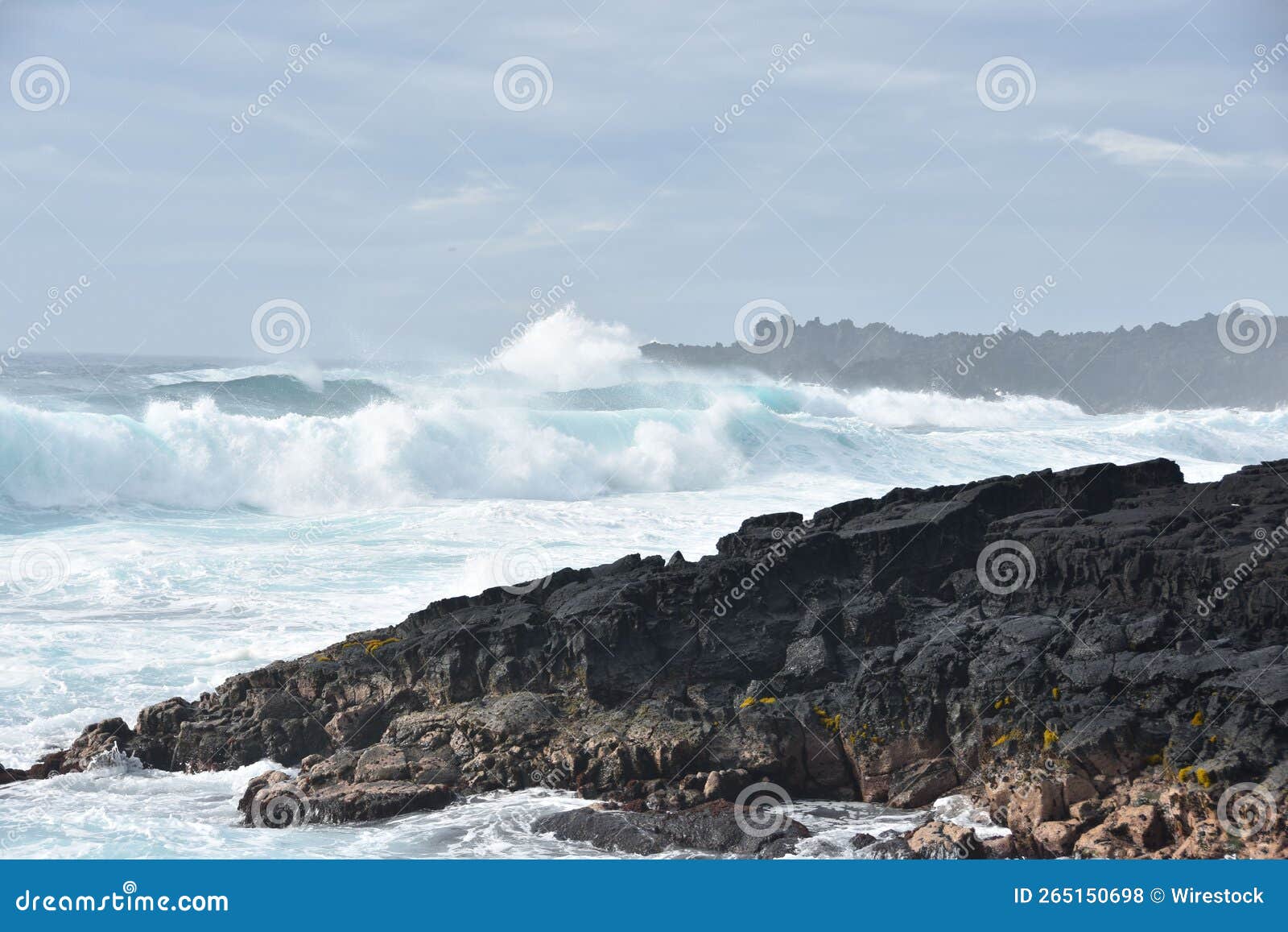 Waves Crashing Onto the Rocks on the Beach Stock Photo - Image of ...