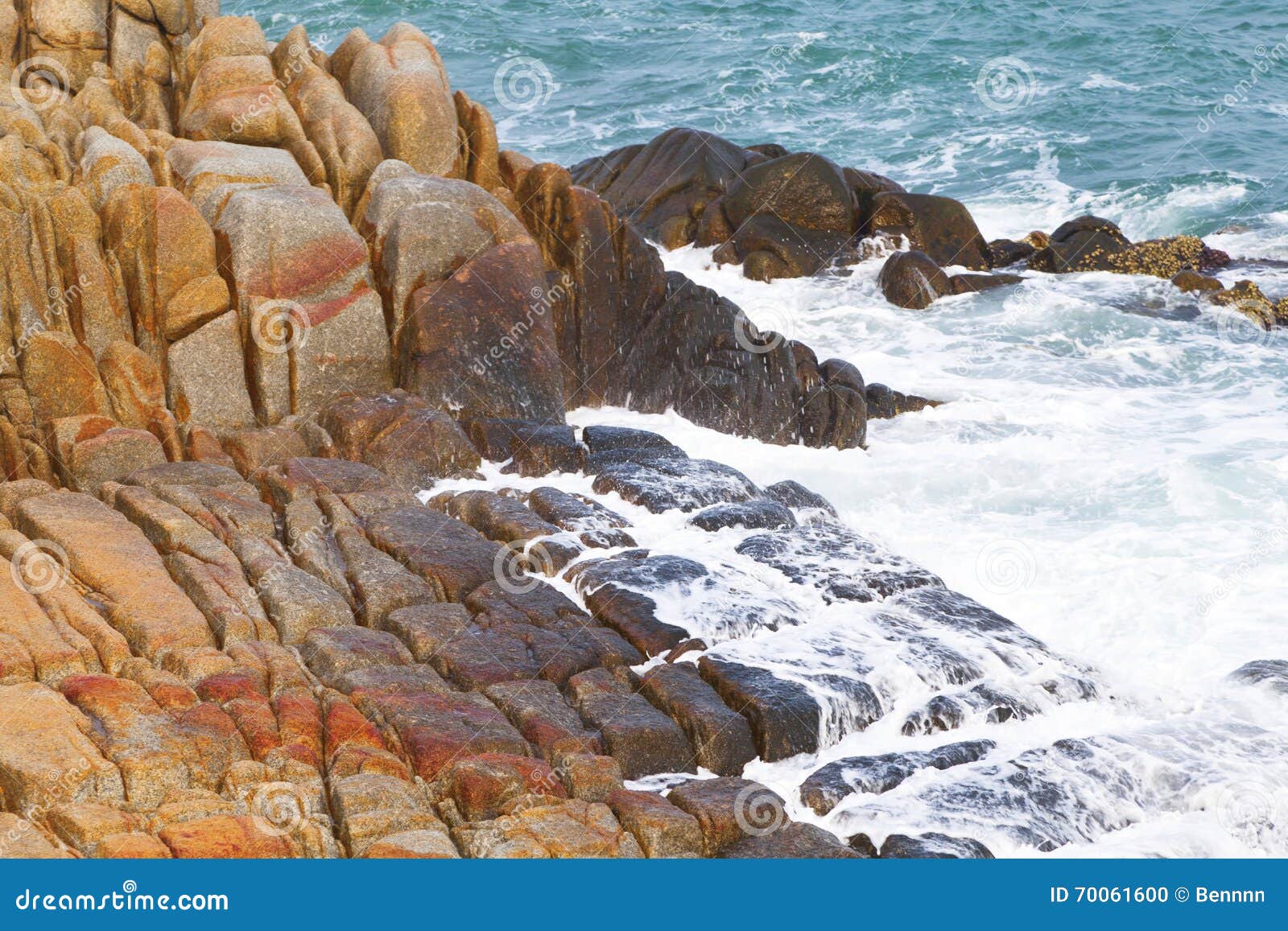 Waves crashing onto rocks stock photo. Image of wave - 70061600