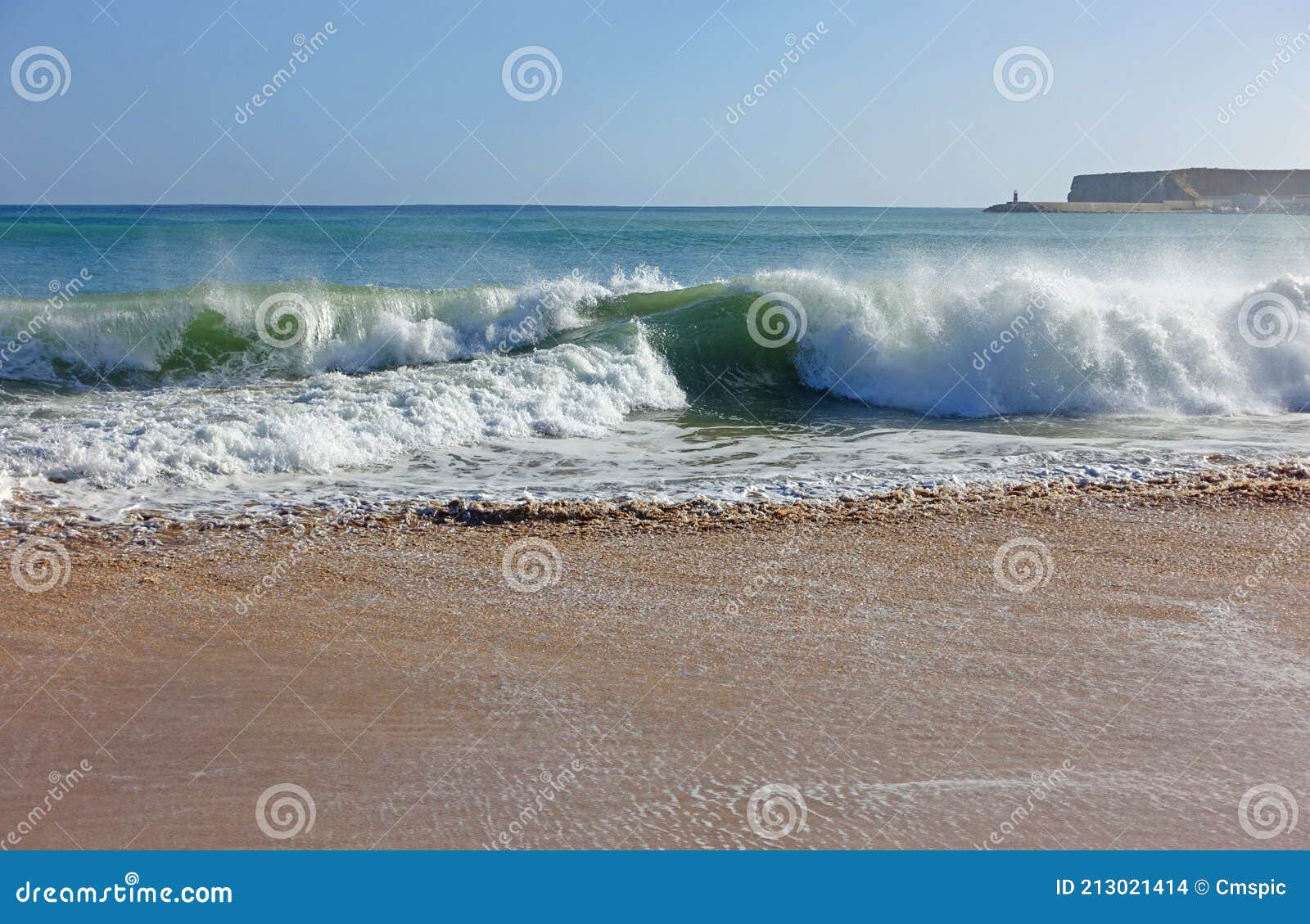 Waves Crashing Onto a Sandy Beach Stock Photo - Image of sunlight ...