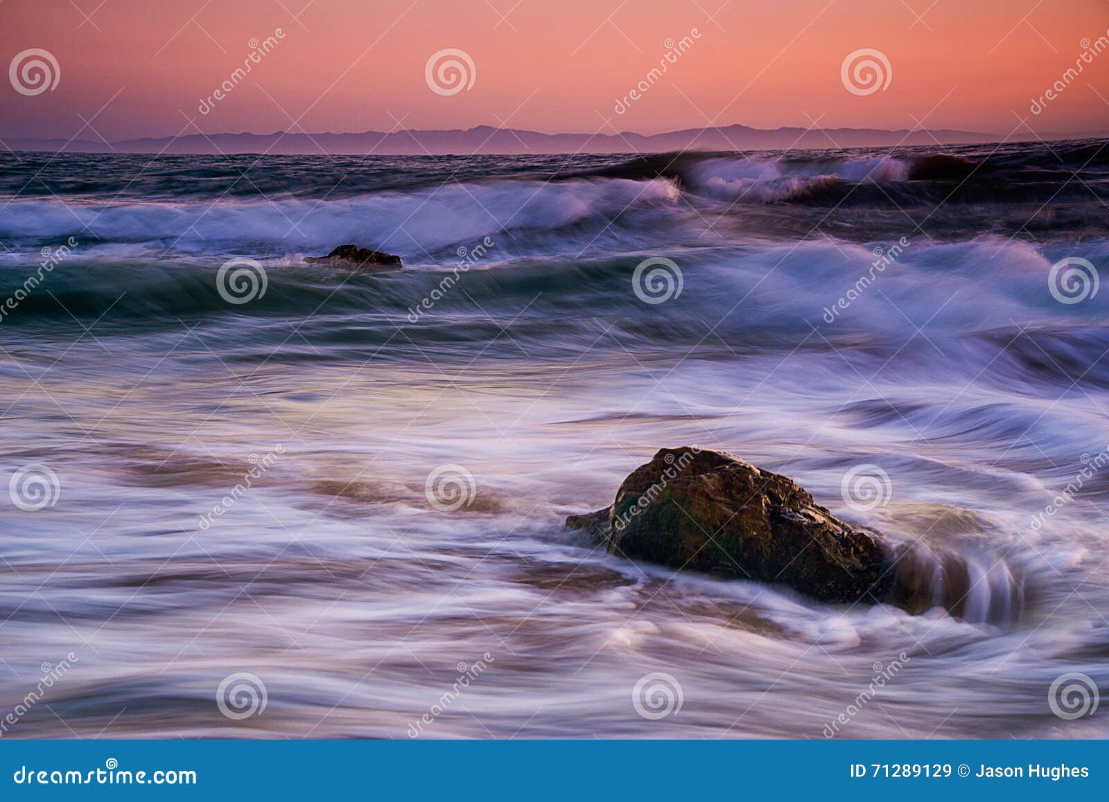 Waves Crashing Over a Rock at Sunset Stock Image - Image of rock ...