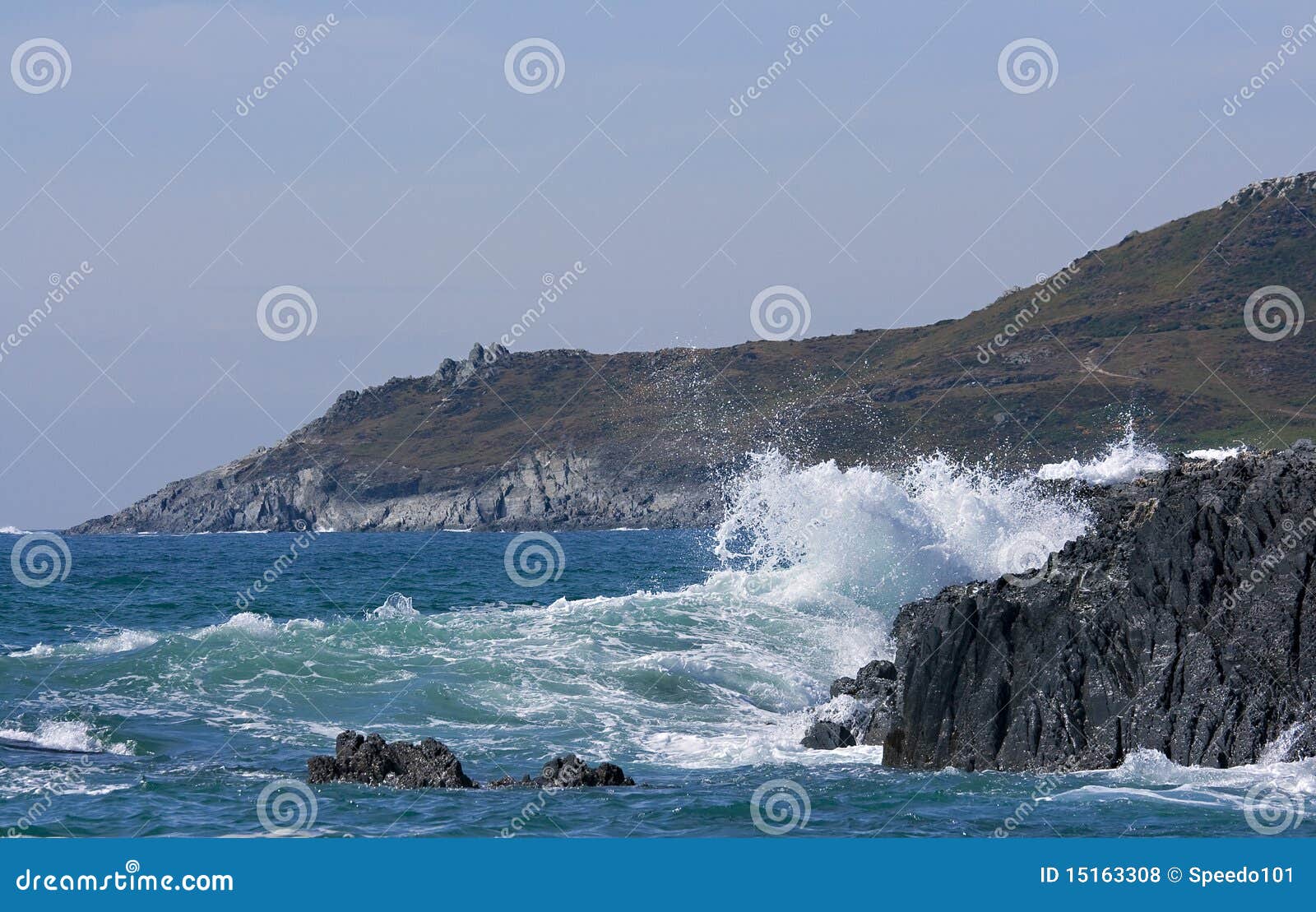 Waves crashing over rocks stock photo. Image of coastline - 15163308