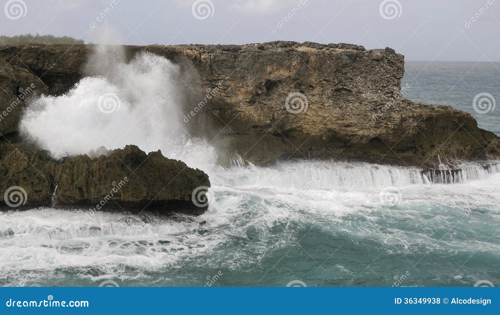 Waves Crashing Over Rocks stock photo. Image of shore - 36349938