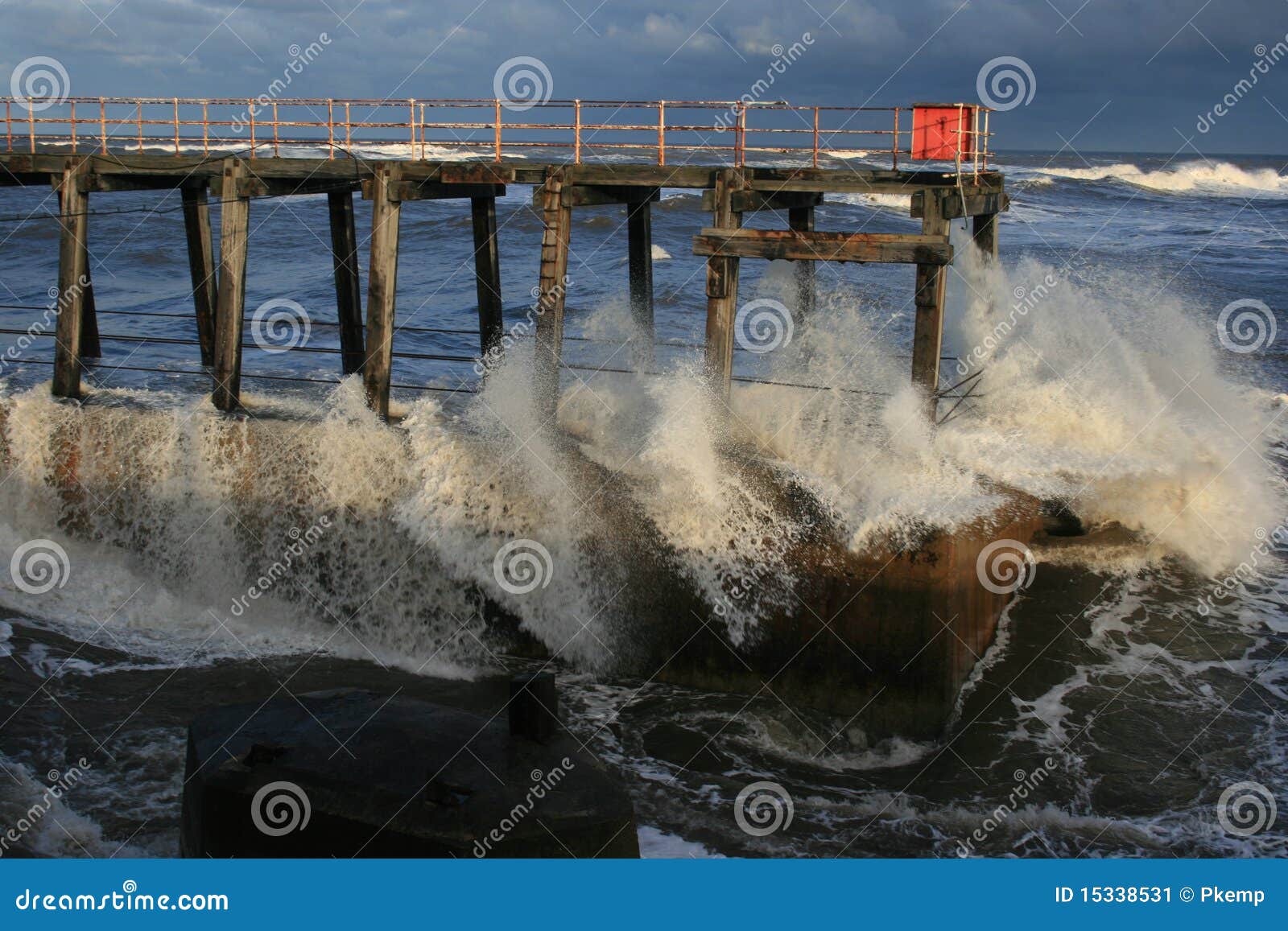 Waves crashing into pier stock image. Image of england - 15338531
