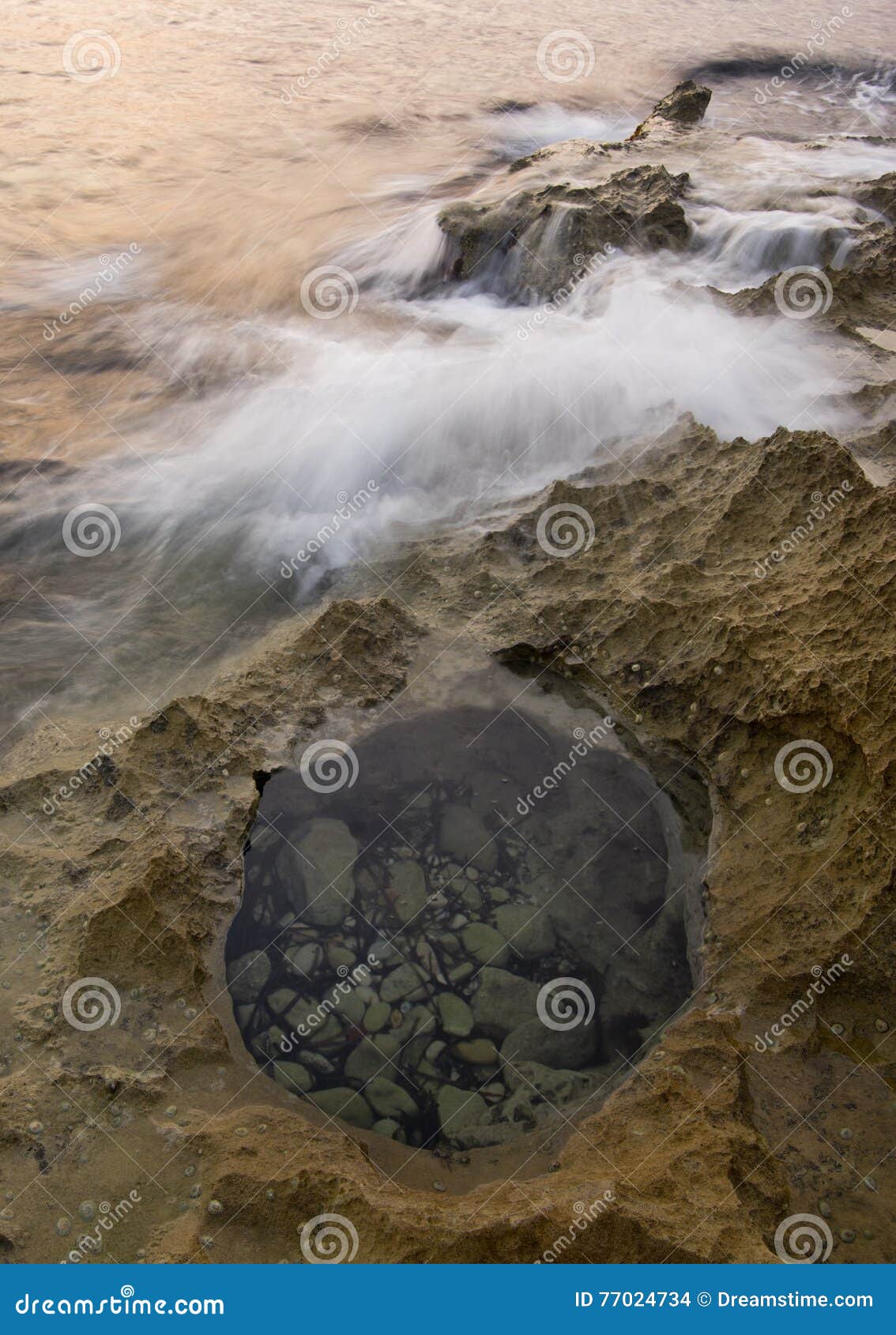 Waves Crashing into a Rock Pool Stock Photo - Image of rocks, pool ...