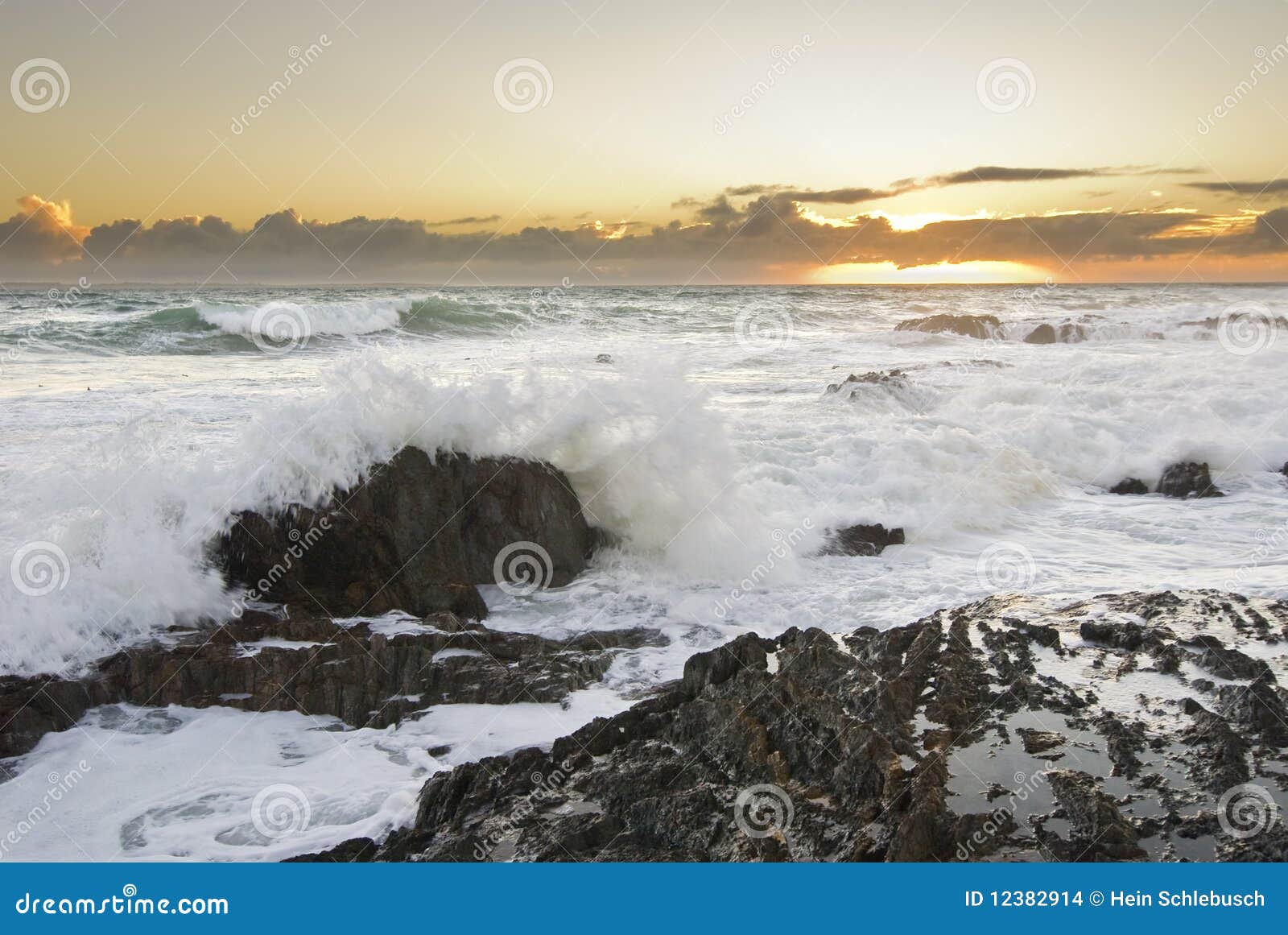 Waves crashing at sunset stock photo. Image of nature - 12382914