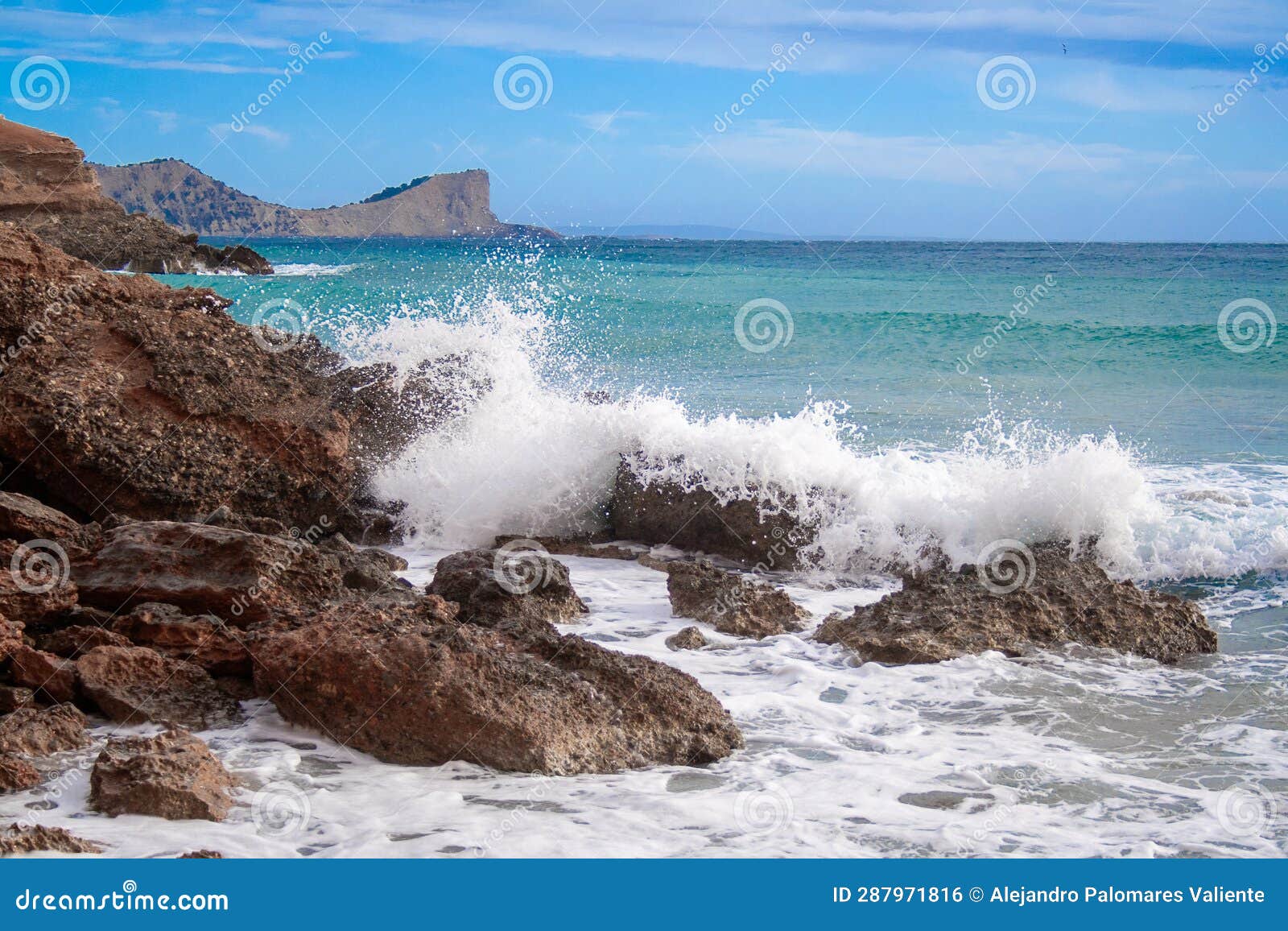 Waves Eating Rocks in a Blue Shore Stock Photo - Image of tower ...
