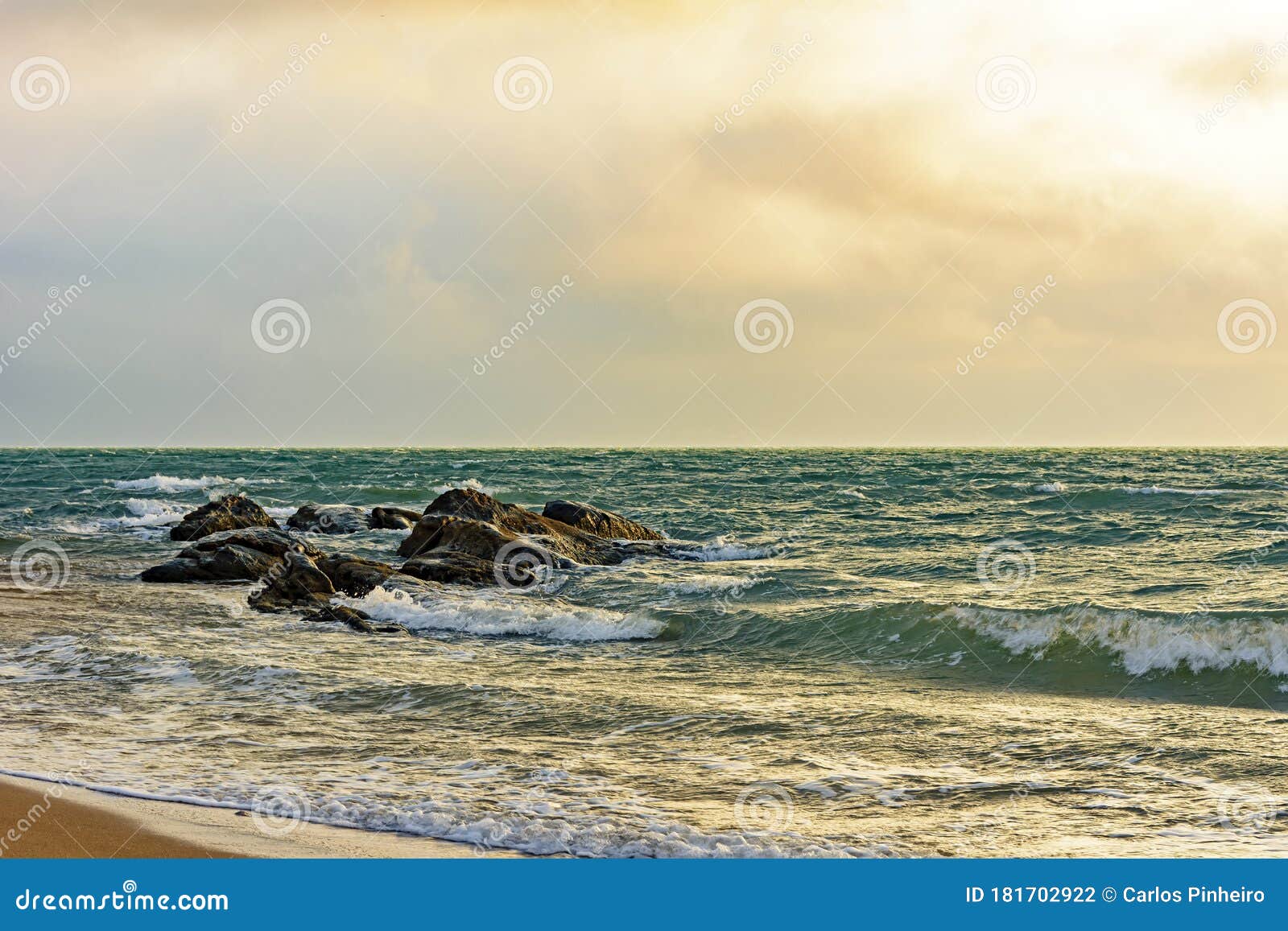 Waves Gently Breaking Over Rocks at Sunset Stock Photo - Image of ...