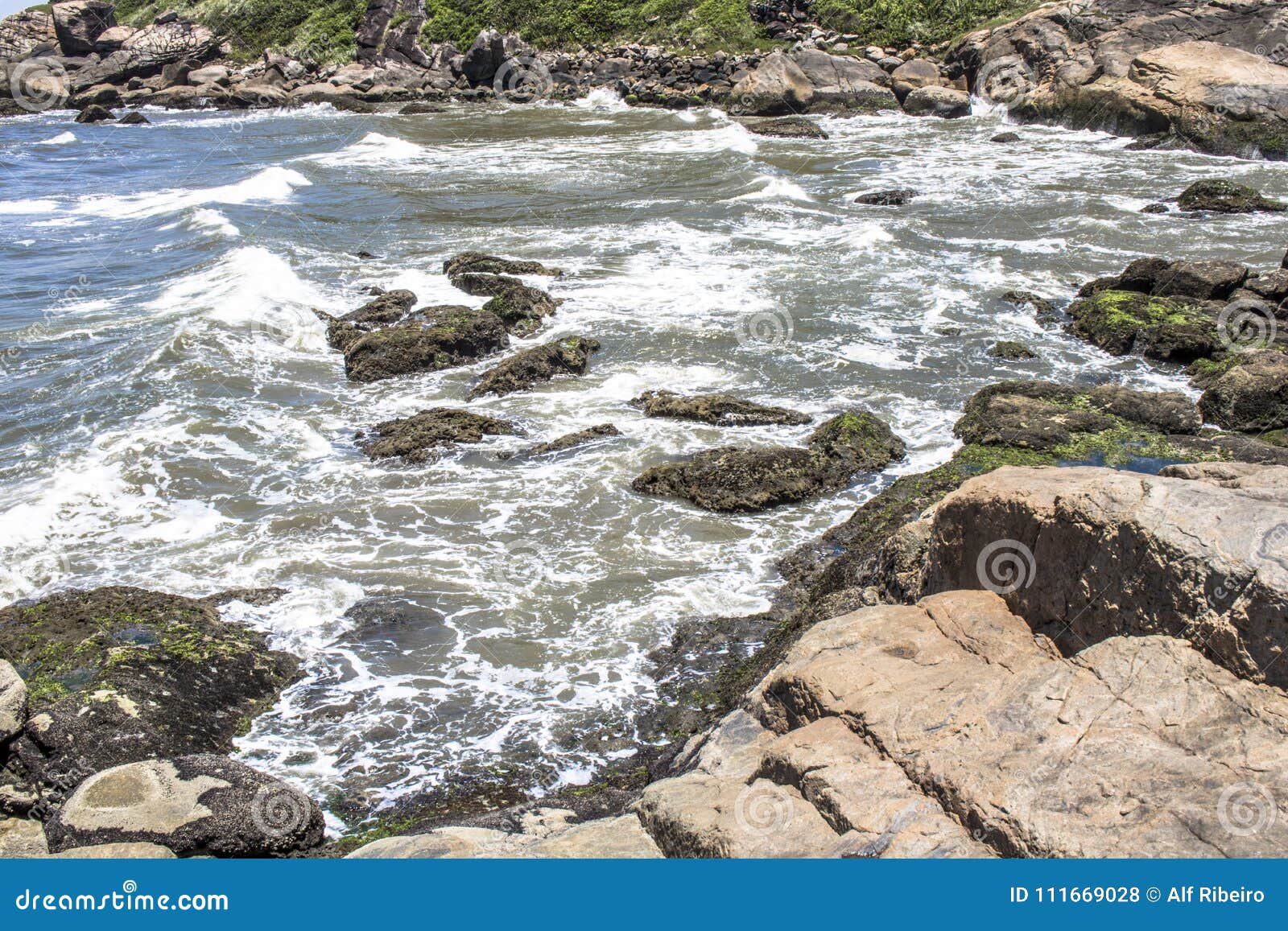 Waves hit the rocks stock photo. Image of brazil, spray - 111669028