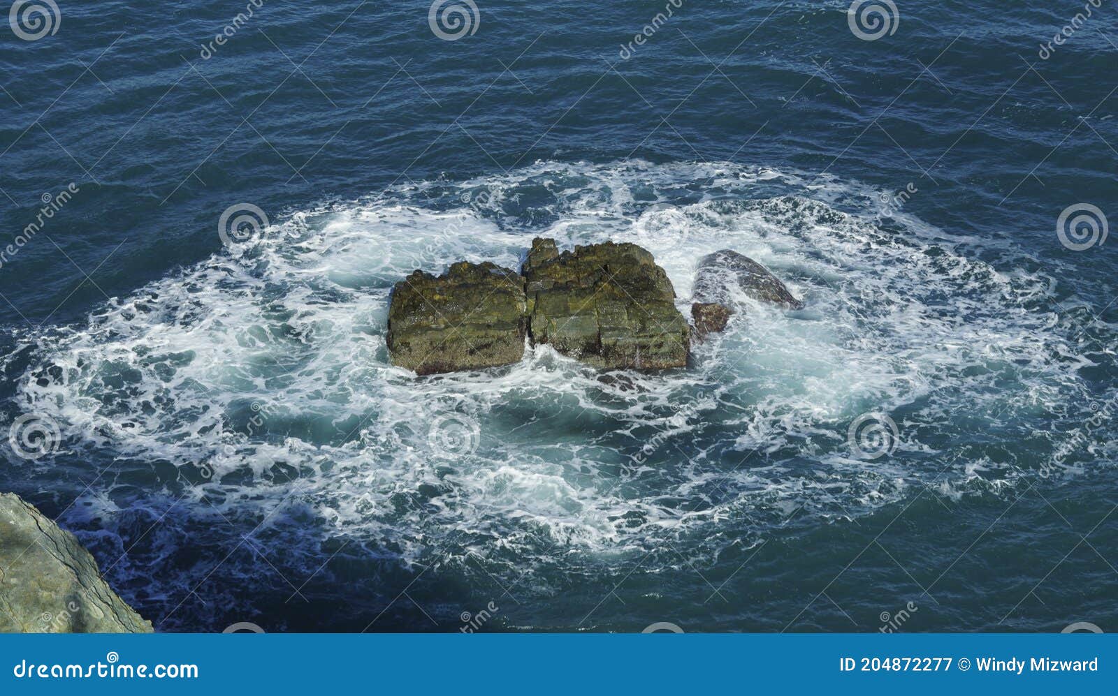 Waves hitting the big rock stock image. Image of ocean - 204872277