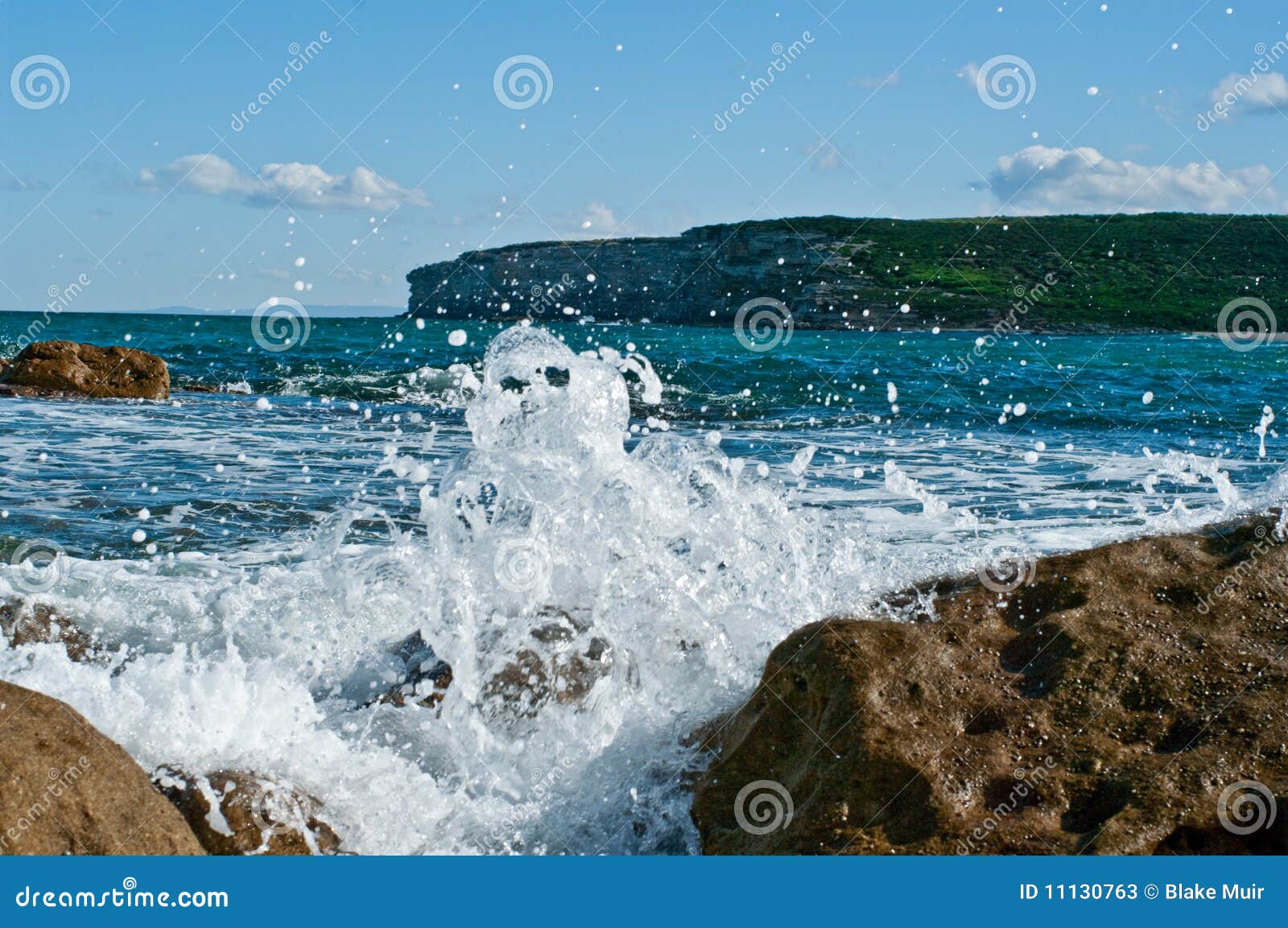 Waves hitting rocks stock image. Image of cloud, scenery - 11130763