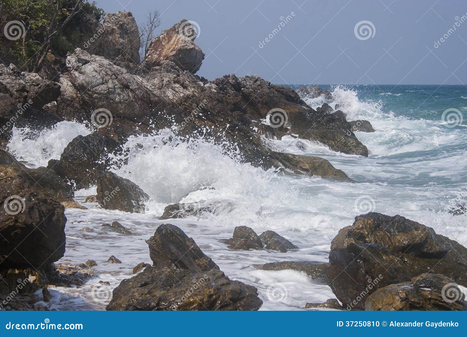 Waves hitting rocks stock photo. Image of waves, water - 37250810