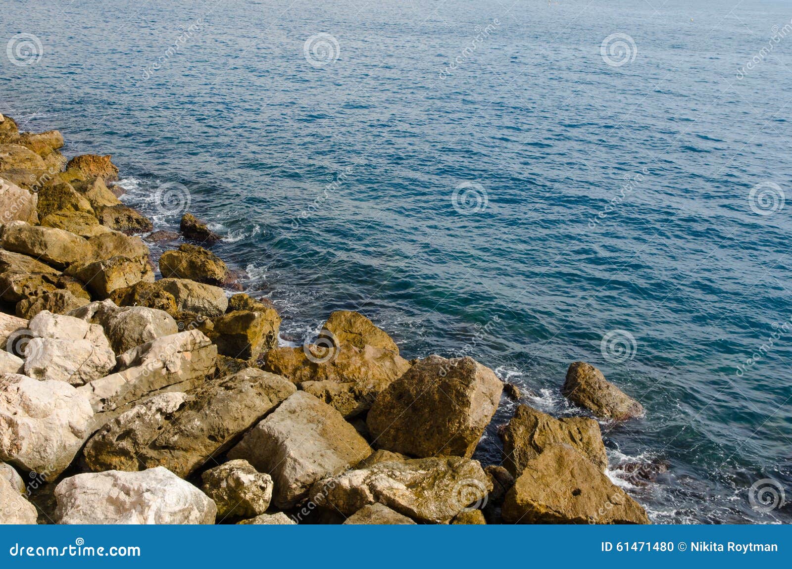 Waves of the Mediterranean Sea Water Crushing into Reddish Rocks Stock ...