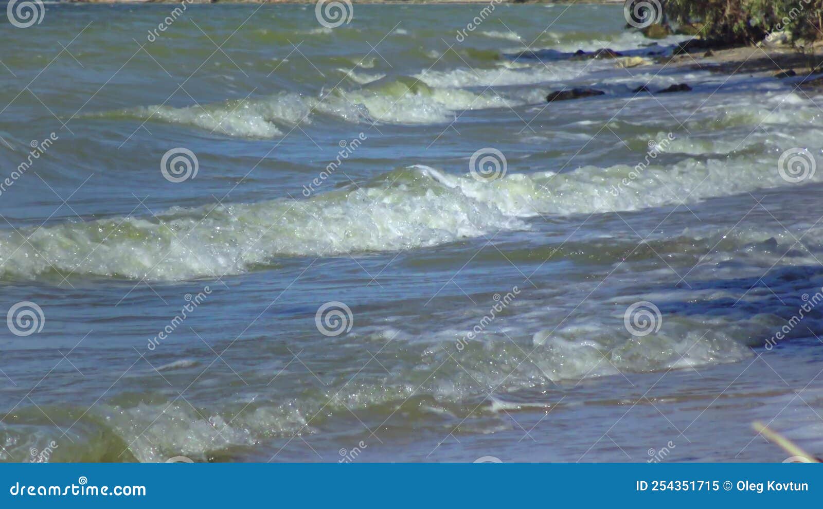 Waves of Muddy Water Roll on the Seashore, Forming Foam Stock Video ...