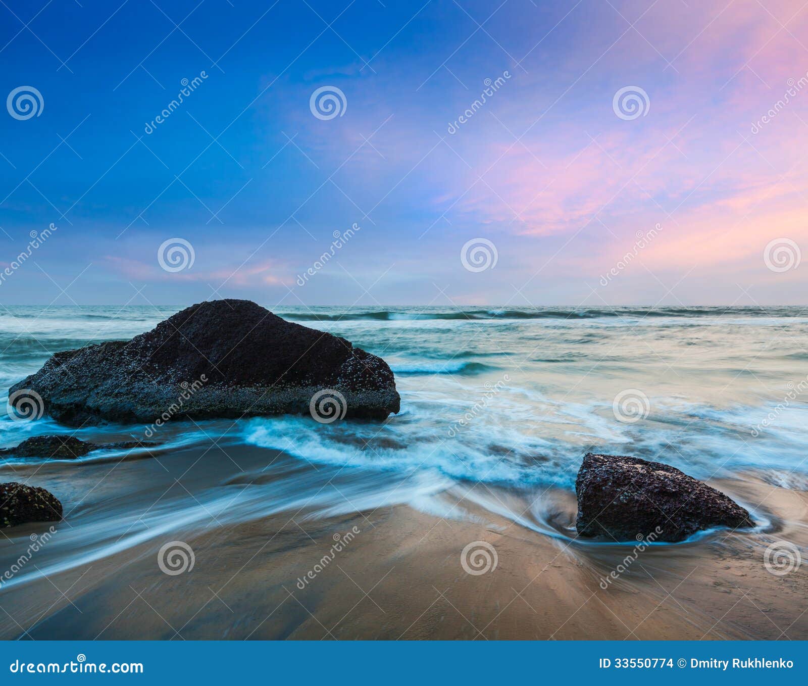 Waves and Rocks on Beach on Sunset Stock Photo - Image of serene, waves ...