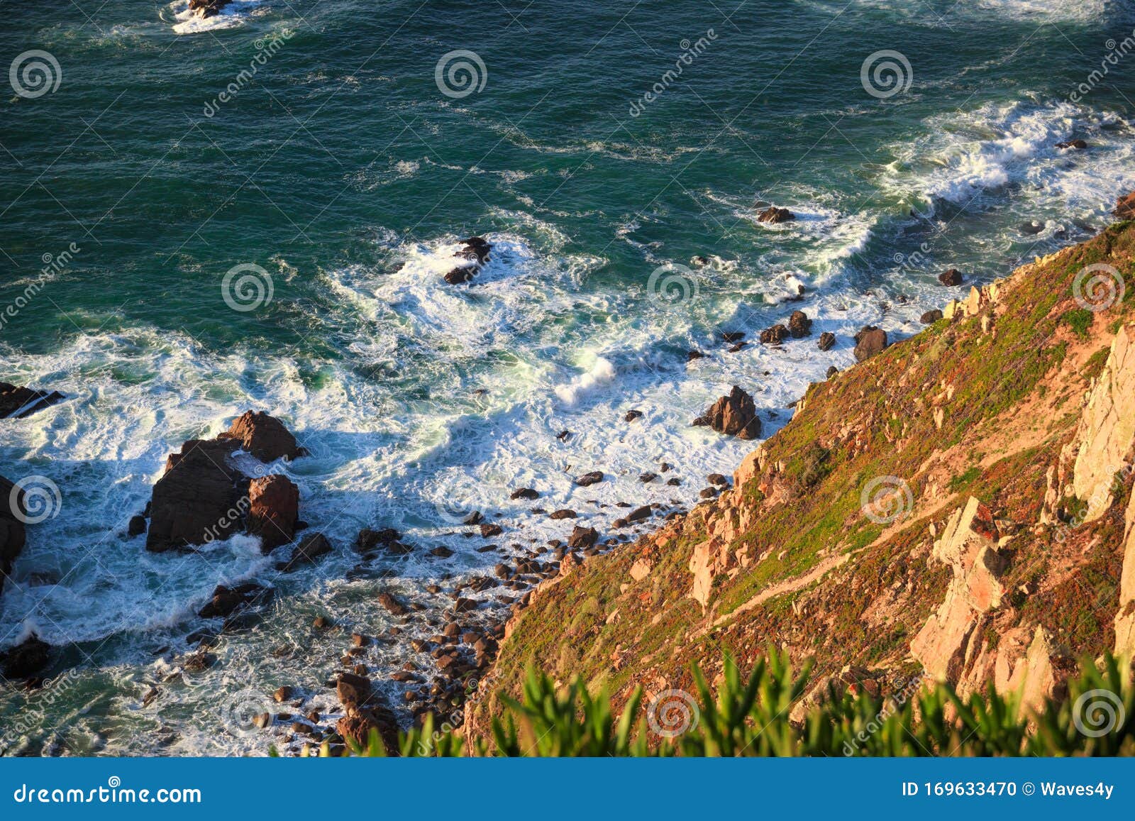 Waves and Rocks in Rays of Setting Sun on Cabo Da Roca, Portugal Stock ...