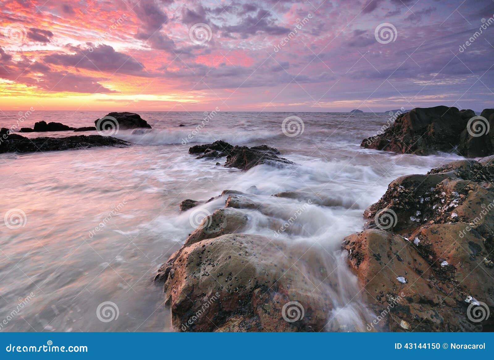 Waves, rocks and sunset stock photo. Image of peaceful - 43144150
