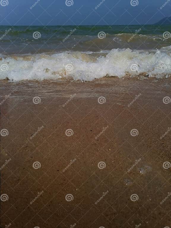 Waves Roll on the Sandy Shore Stock Photo - Image of waves, sandy ...