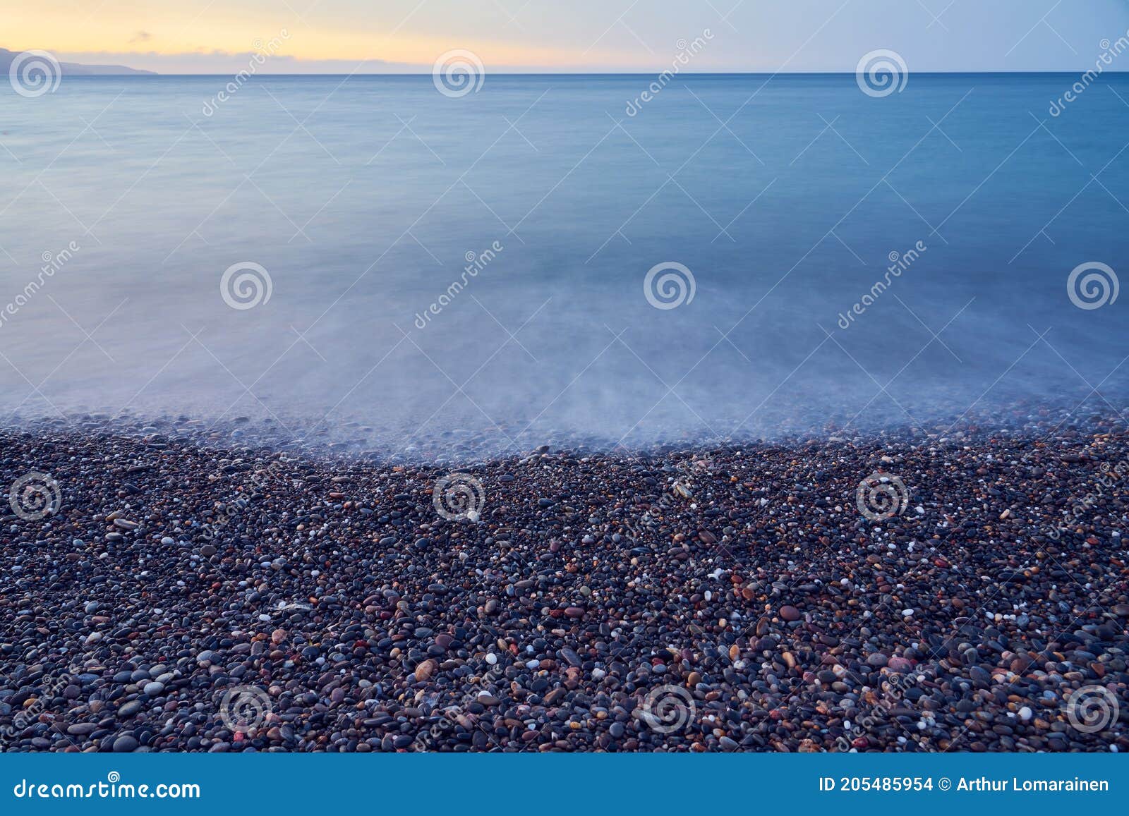 Waves Rolled on the Pebble Beach with the Sunset Horizon in the ...