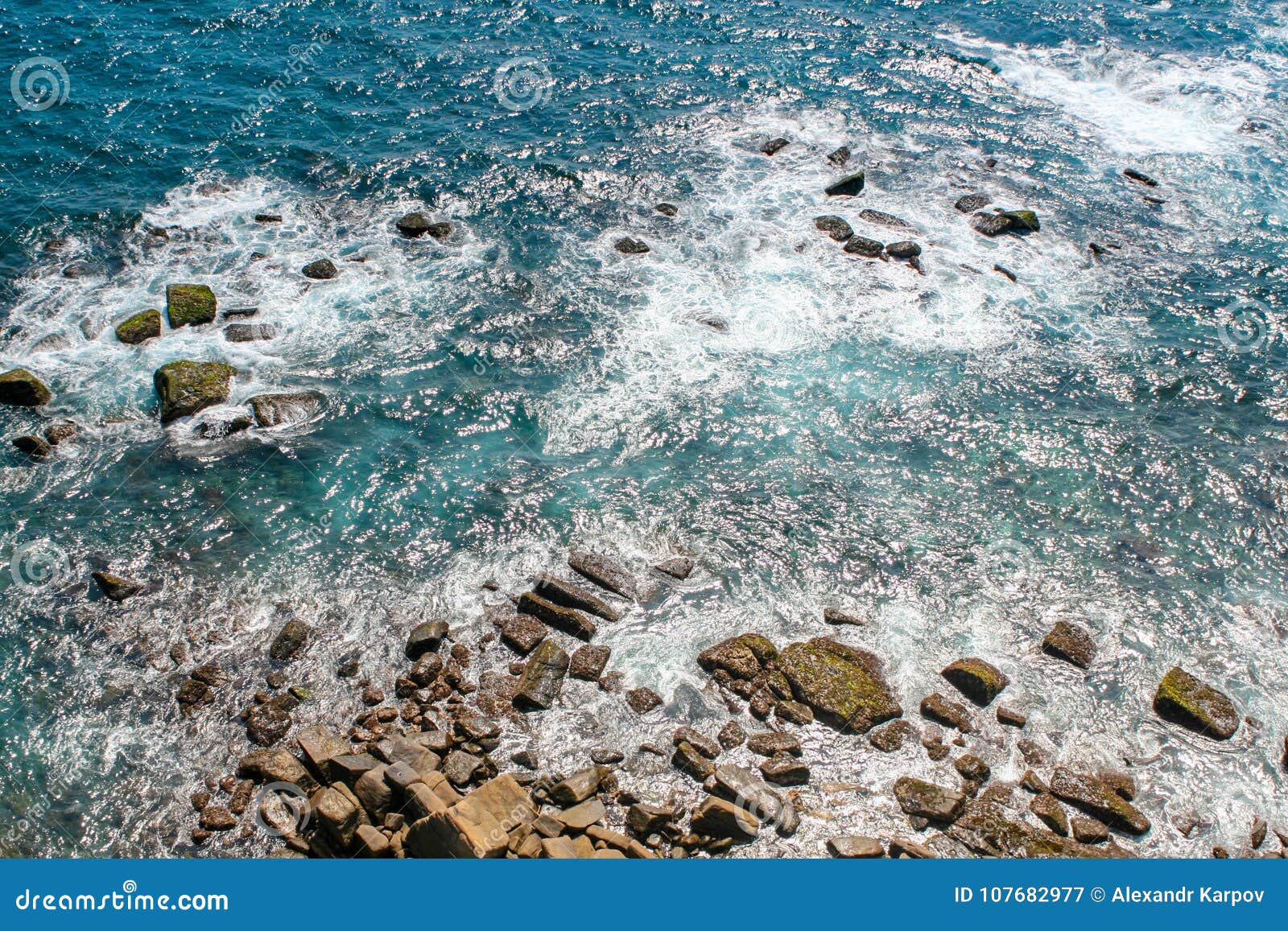 Waves rush into the rocks stock image. Image of rocky - 107682977