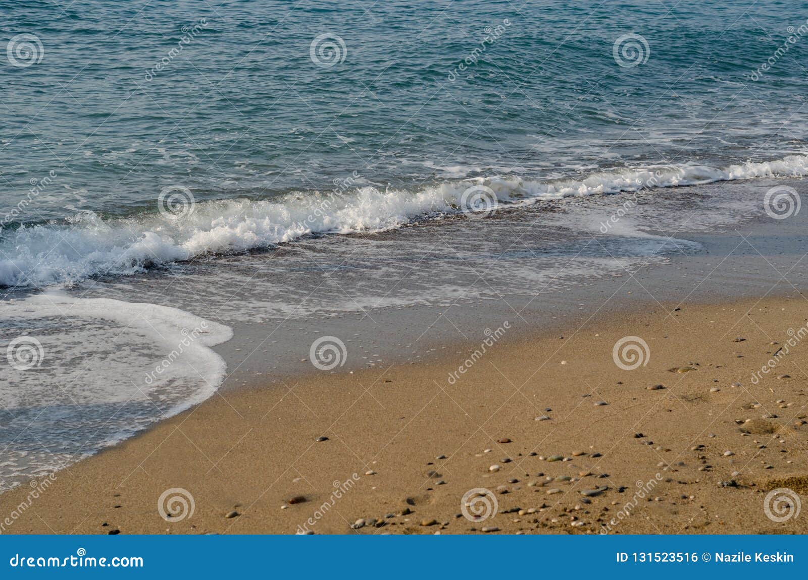 Waves on a sandy beach. stock photo. Image of pages - 131523516