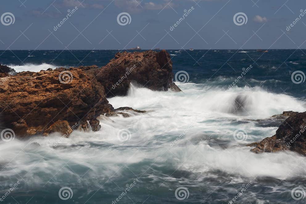 Waves of the Sea Breaking on the Rocks of the Beach Stock Photo - Image ...