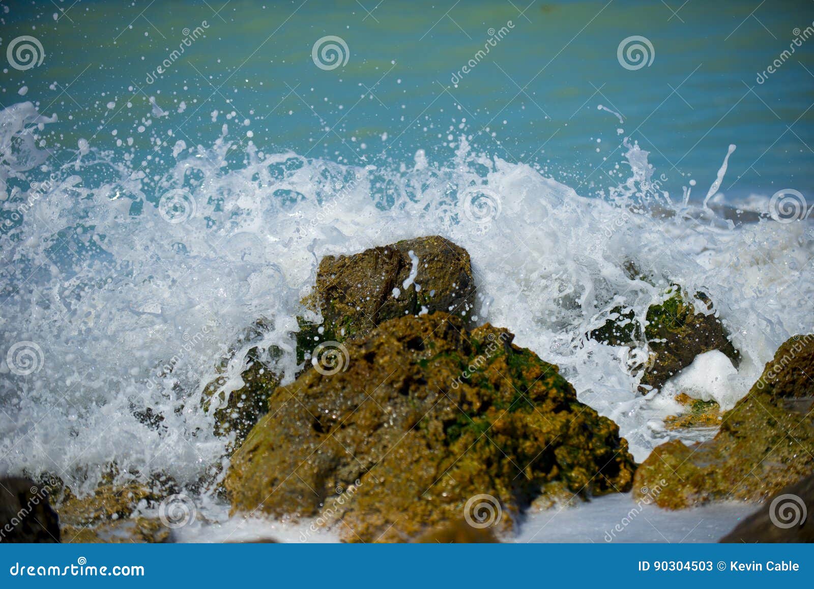 Waves Splashing Over Rocks on the Beach Stock Image - Image of splashes ...