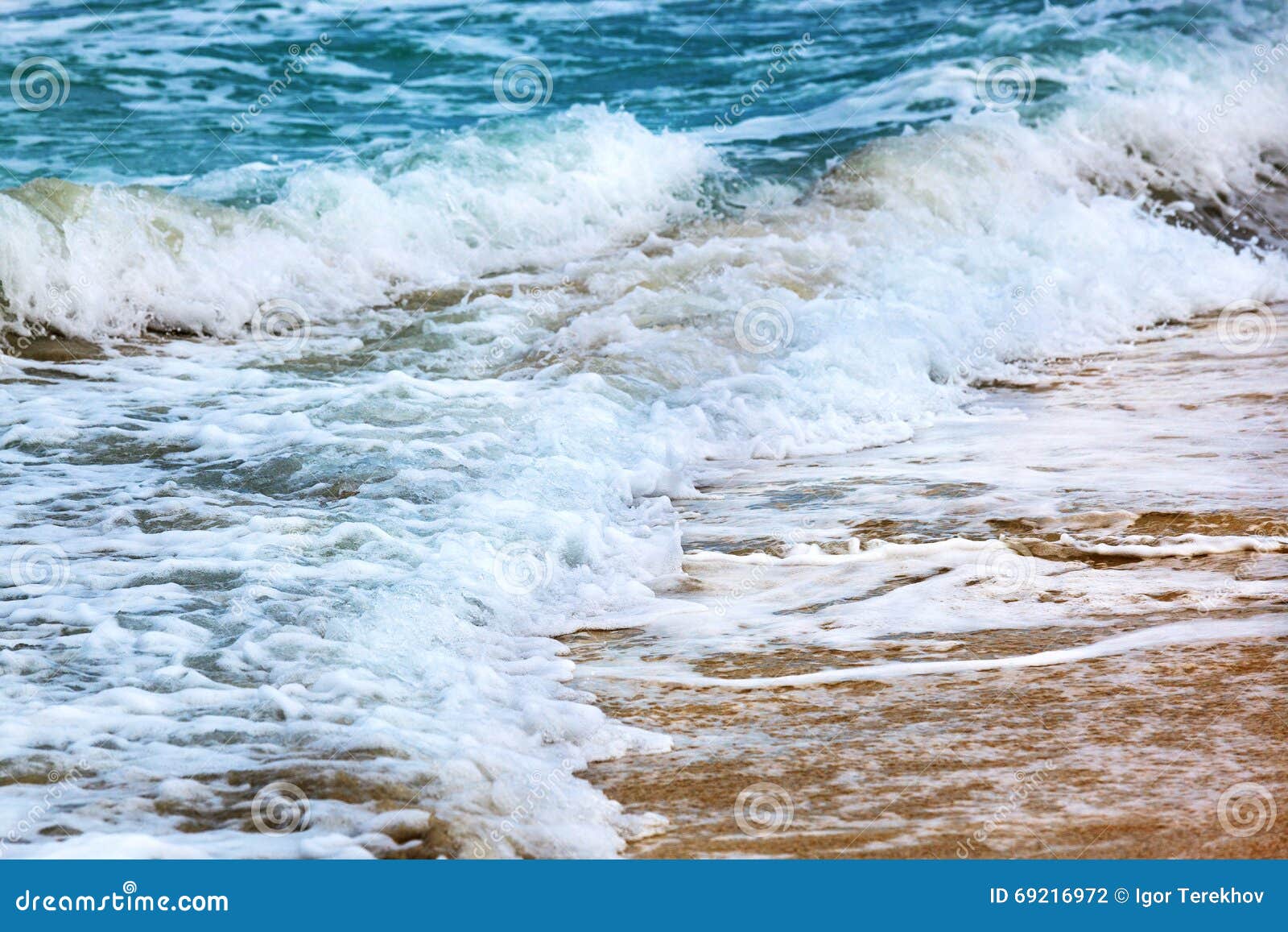 Waves on a sunny day stock photo. Image of sandy, white - 69216972