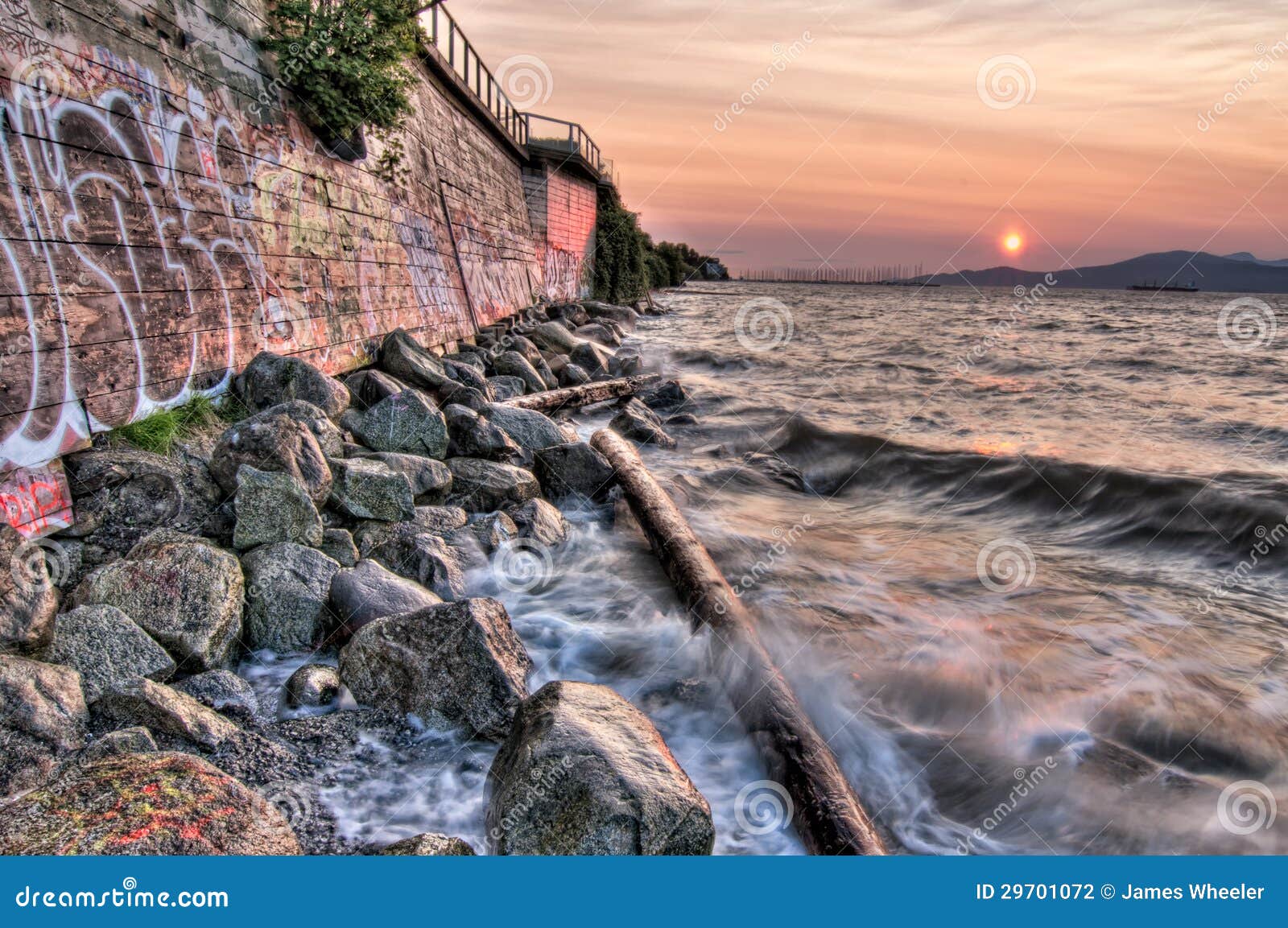 Graffiti on Wall beside Ocean with Waves Stock Photo - Image of spray ...
