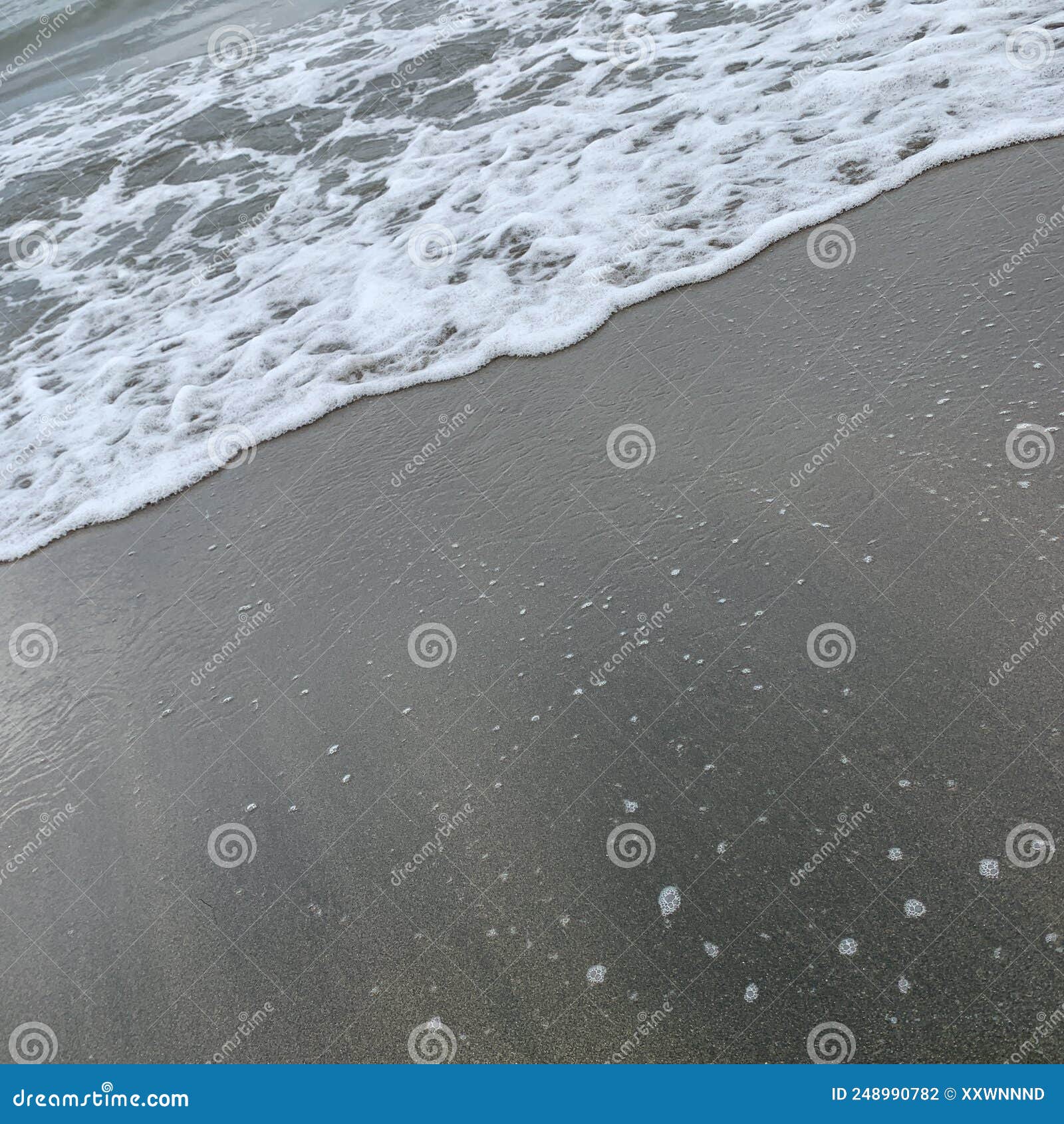 Waves Sweep the Sand in the Ocean Stock Photo - Image of wave, foam ...