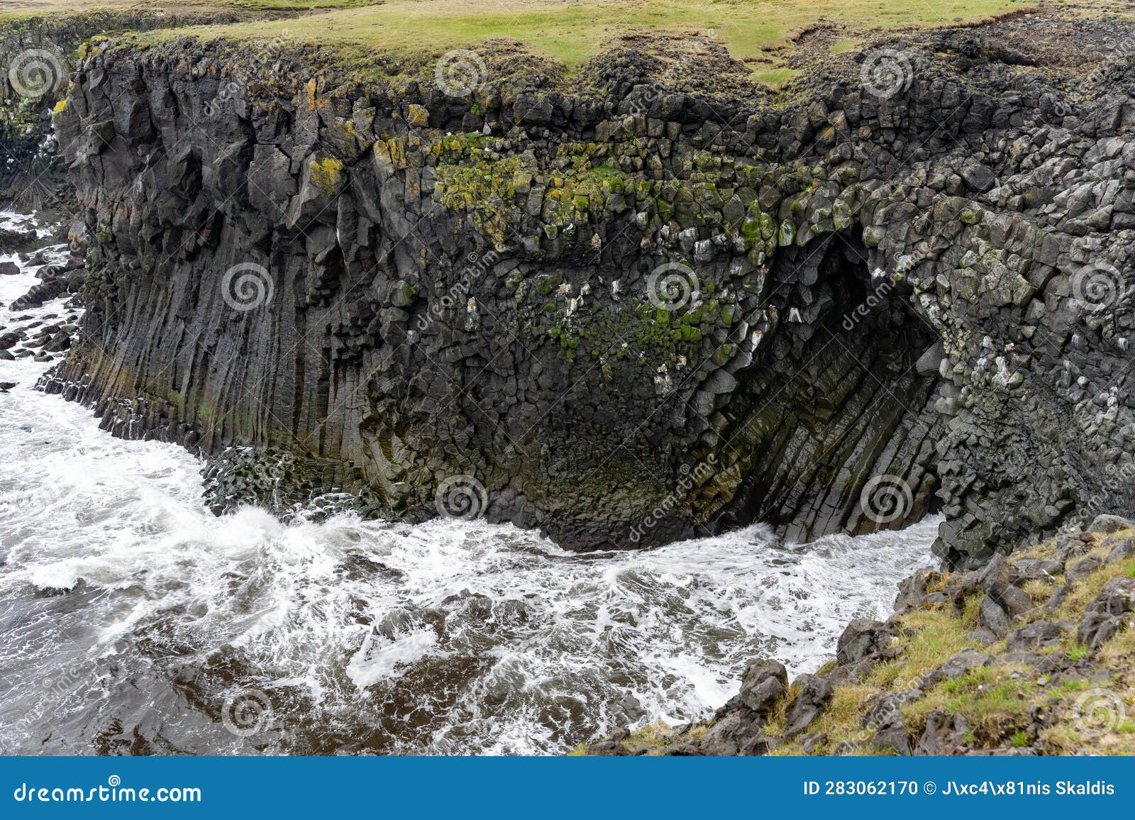 Waves Washing Against Black Basalt Cliffs at Arnarstapi Cliffs in ...