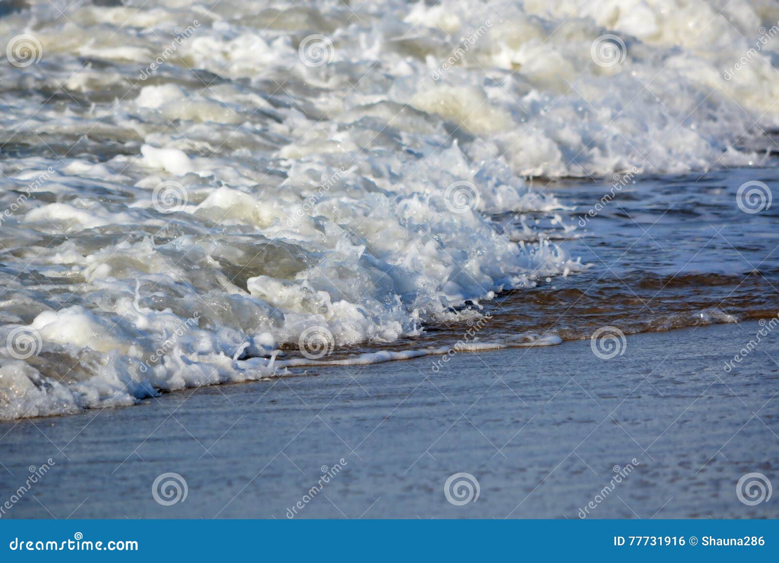 Waves Washing Up Onto the Shore Stock Photo - Image of sand, foaming ...