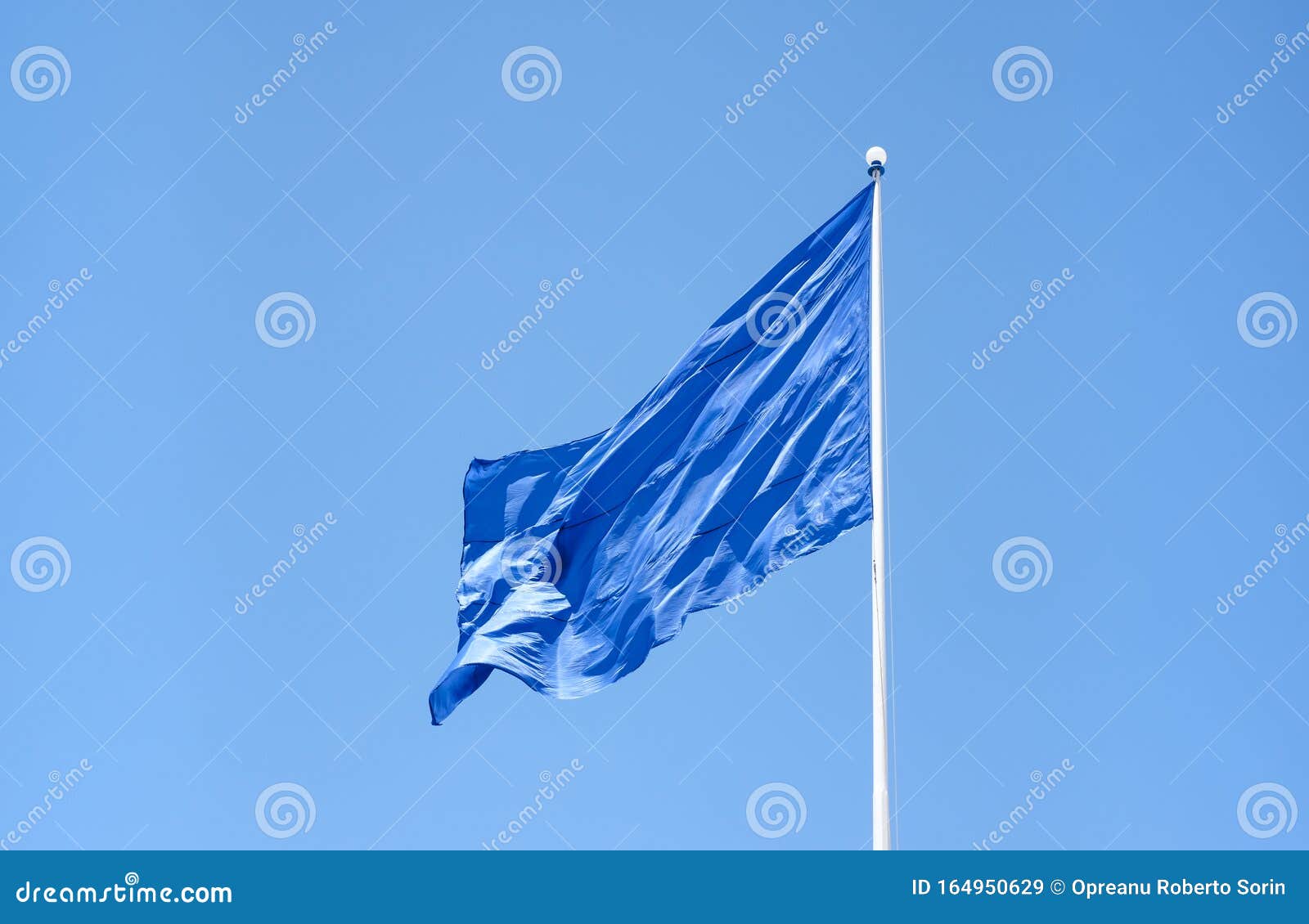Waving Blue Flag on Blue Sky Stock Image - Image of graphic, blowing ...