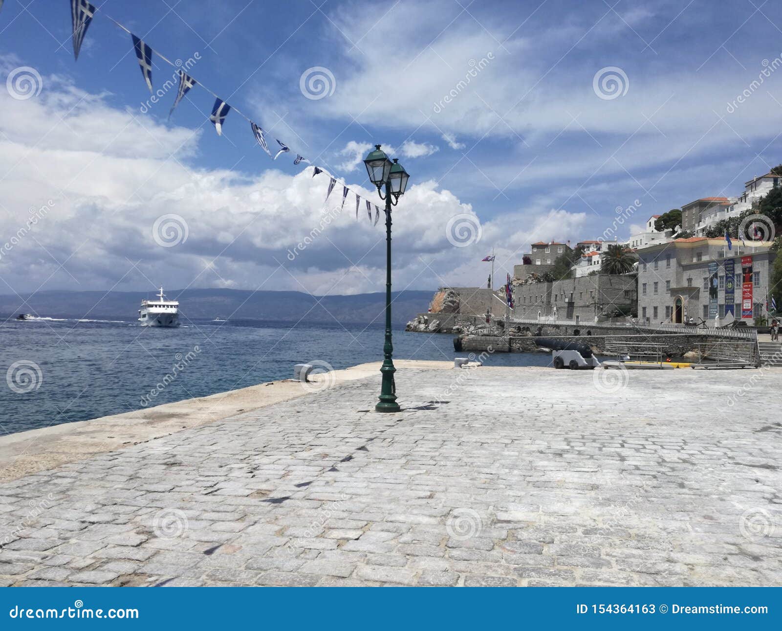 Waving flags in the port stock image. Image of greece - 154364163