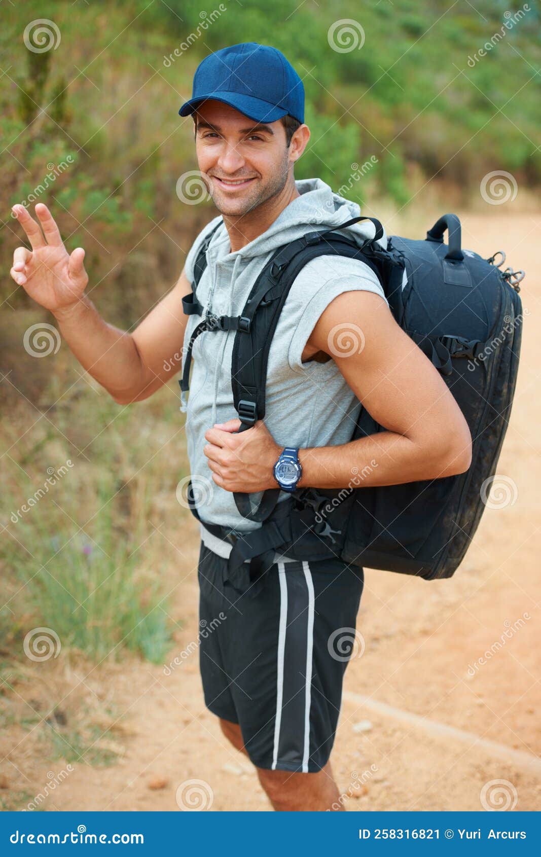 Waving Wanderer. Handsome Young Hiker Waving at the Camera - Portrait ...