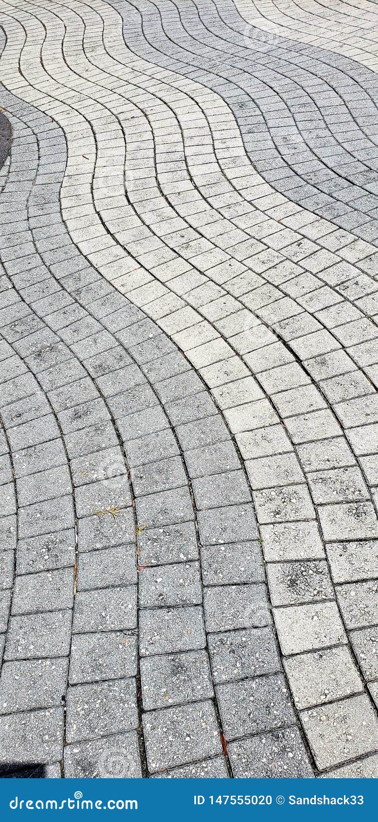 Wavy brick walkway stock photo. Image of illusion, artistic - 147555020