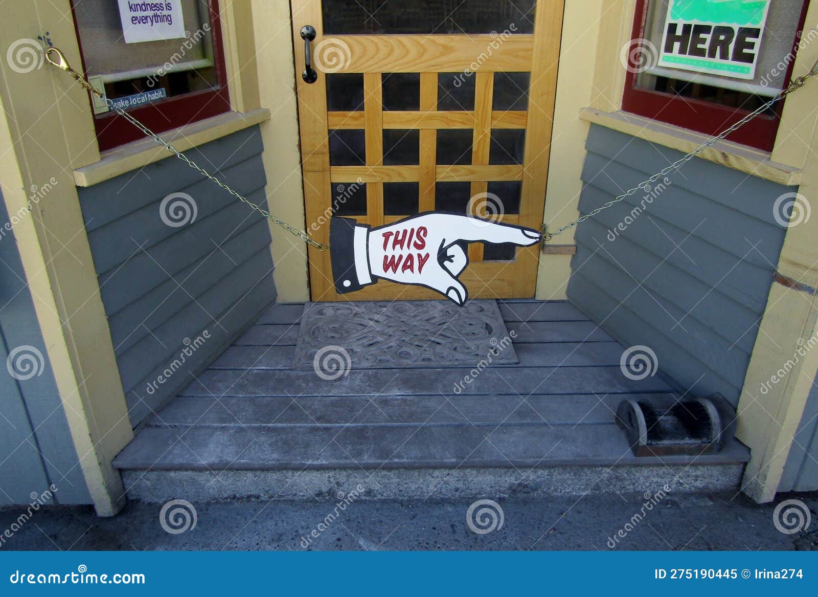 This Way Direction Sign Hanging in Front of Door Stock Image - Image of ...