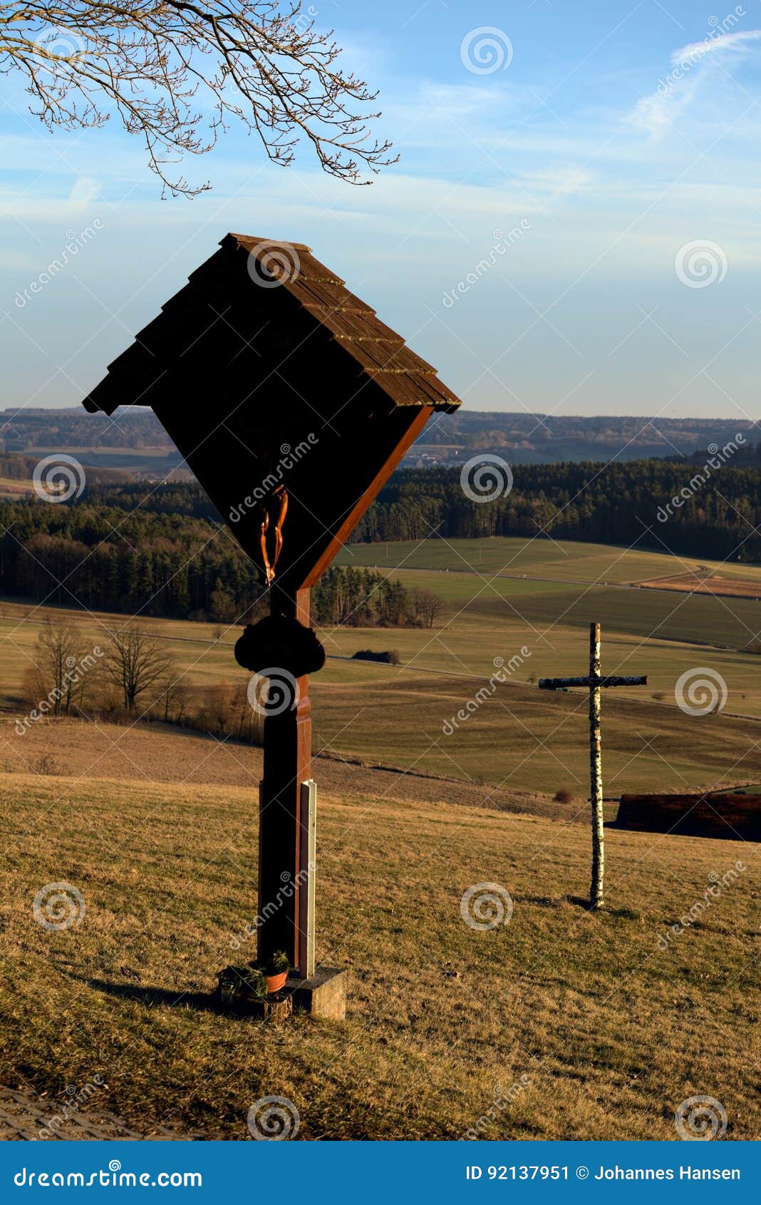 Wayside Cross with Carvings in Shadow and a Simple Birch Cross Stock ...