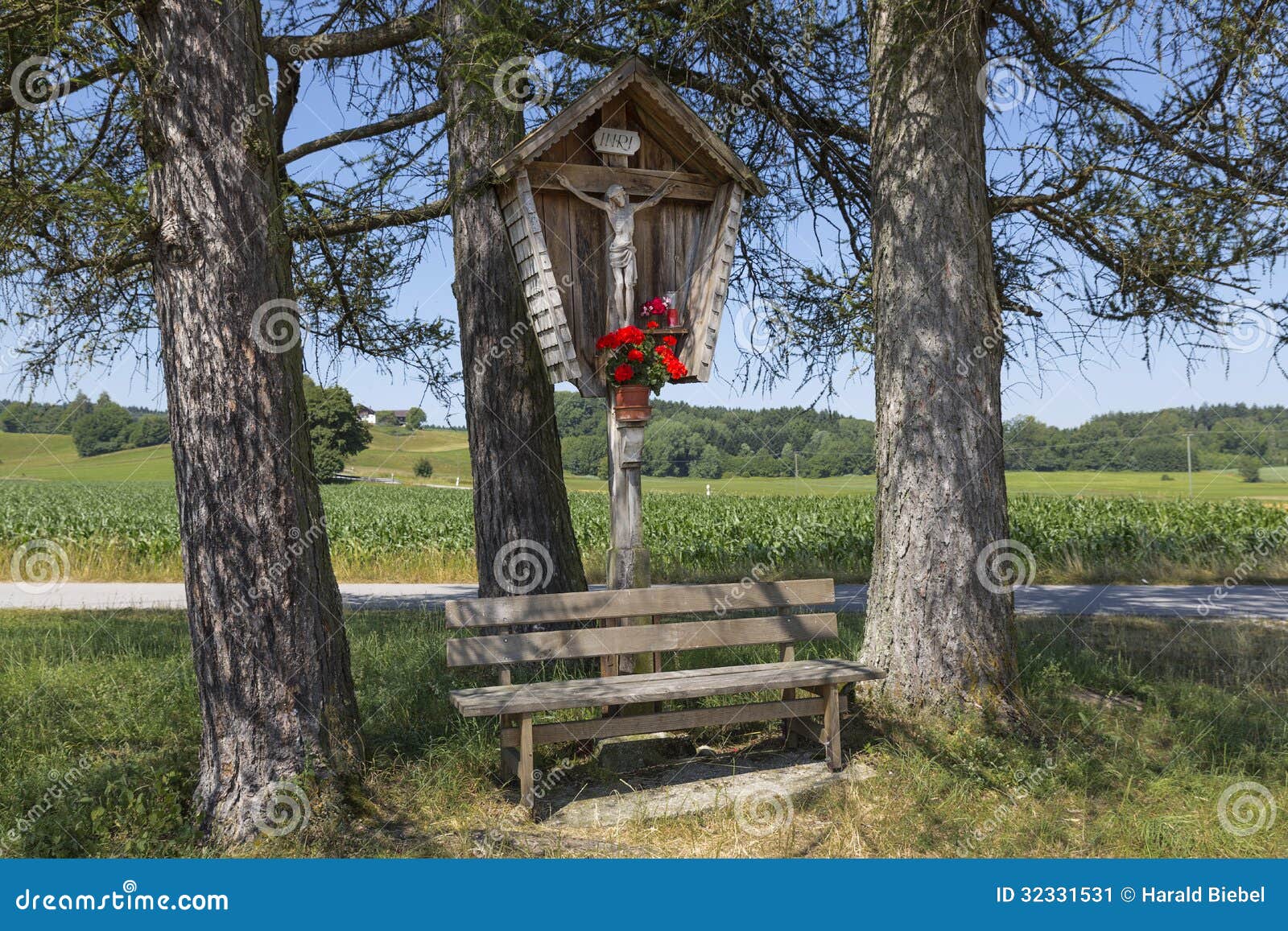 Wayside Shrine With Crucified Jesus Figure And Bench Stock Photo ...